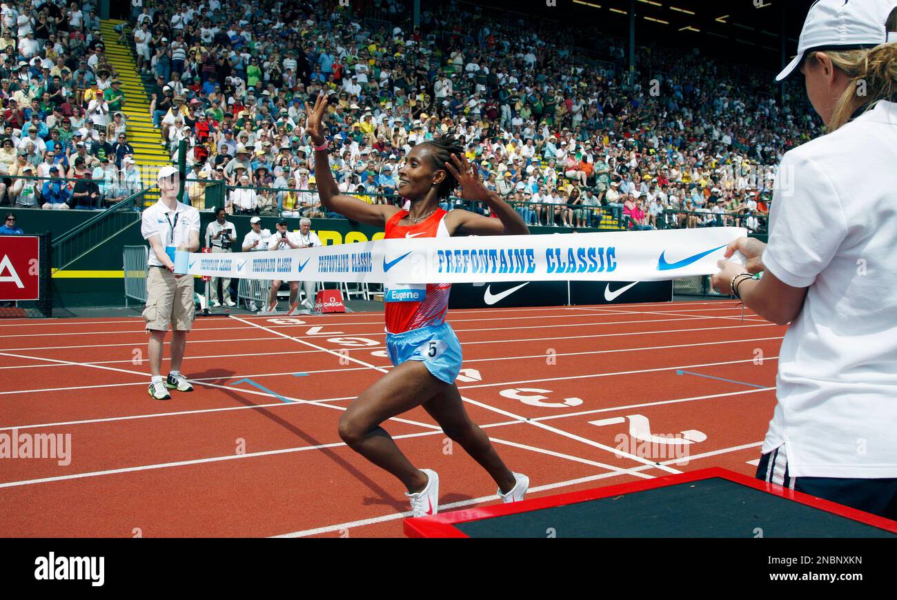 Gelete Burka, from Ethiopia, wins the 1,500 meter race during the ...