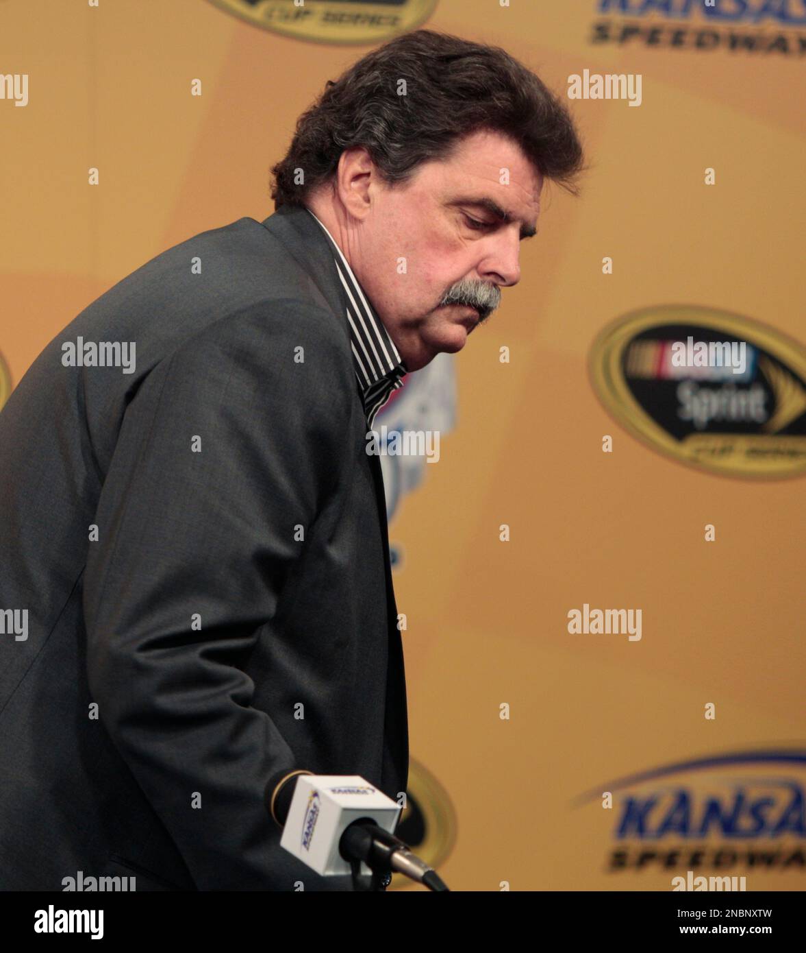 NASCAR president Mike Helton leaves a news conference before a NASCAR ...