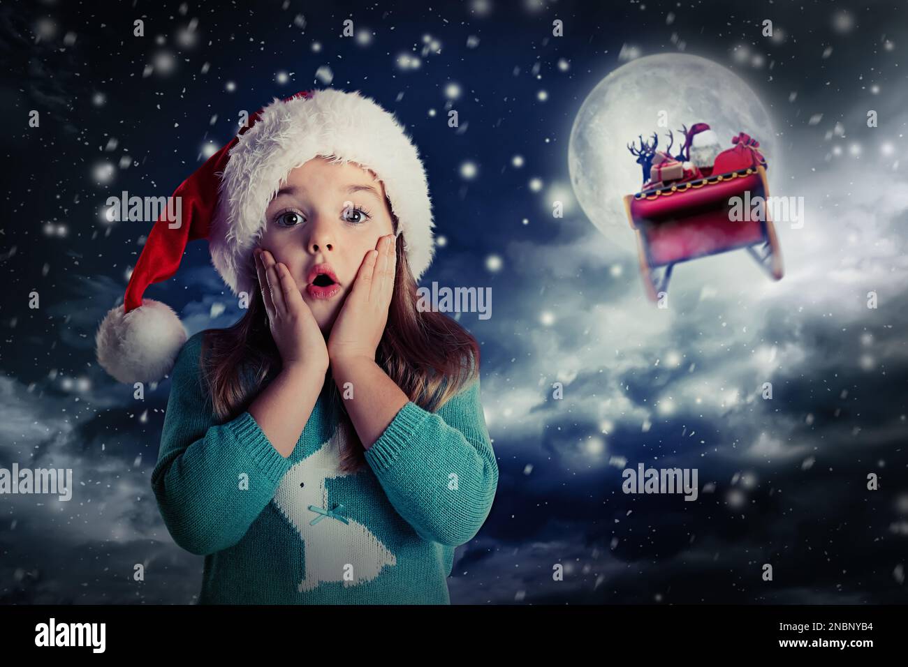 Cute little child and Santa Claus flying in his sleigh on background ...