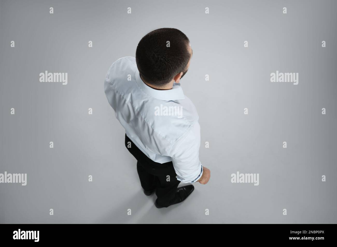 Man in formal clothes on grey background, back view Stock Photo - Alamy