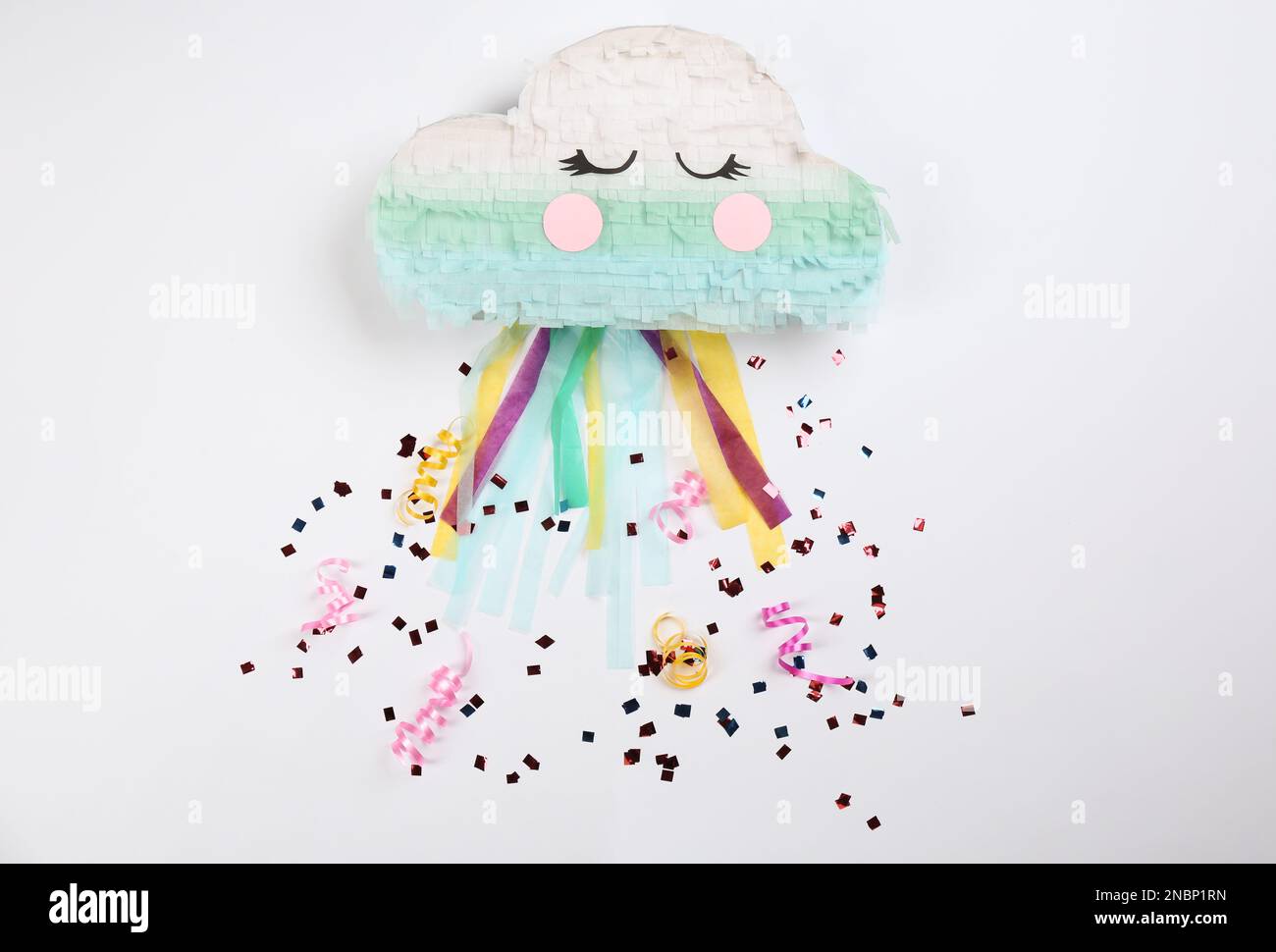 Cloud shaped pinata, streamers and glitter on white background, top ...