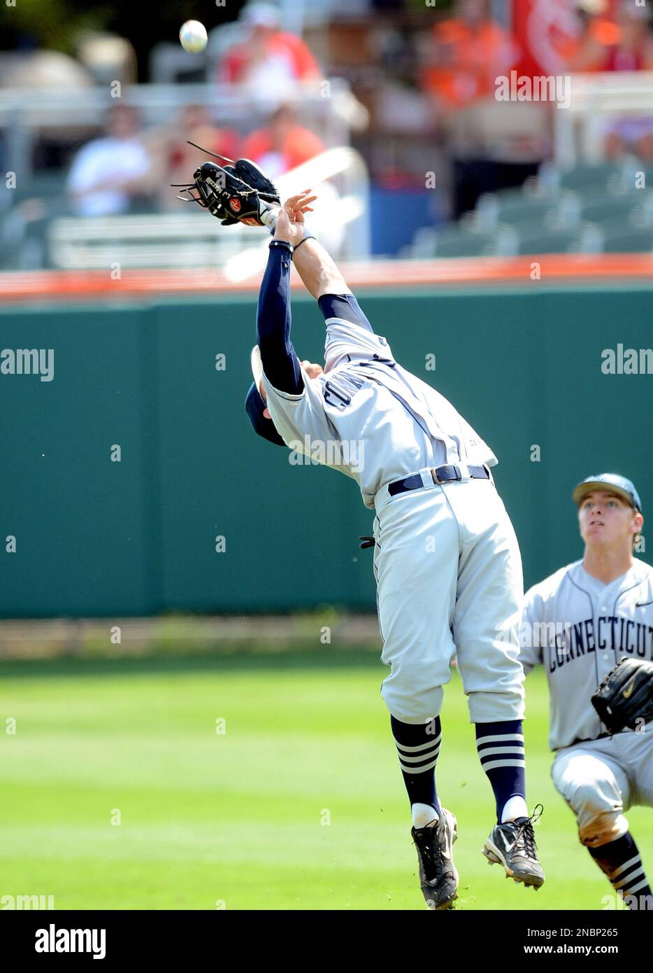 Connecticut second baseman L.J. Mazzilli, left, makes a catch against ...
