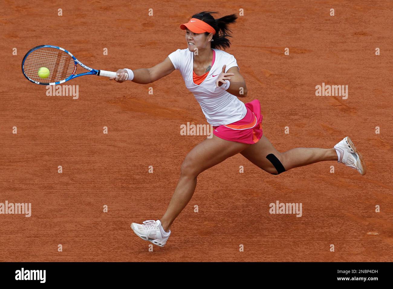 Li Na of China returns the ball to Francesca Schiavone of Italy in the ...