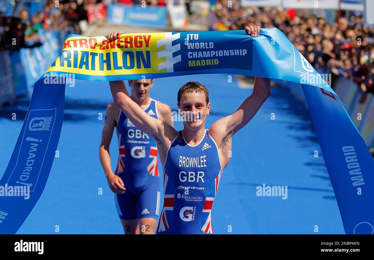 Alistair Brownlee from Great Britain, centre, followed by his brother ...