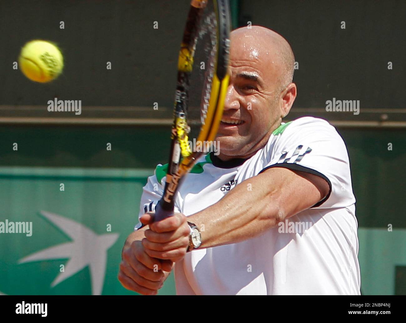 Andre Agassi of the US returns in an exhibition match of the French ...