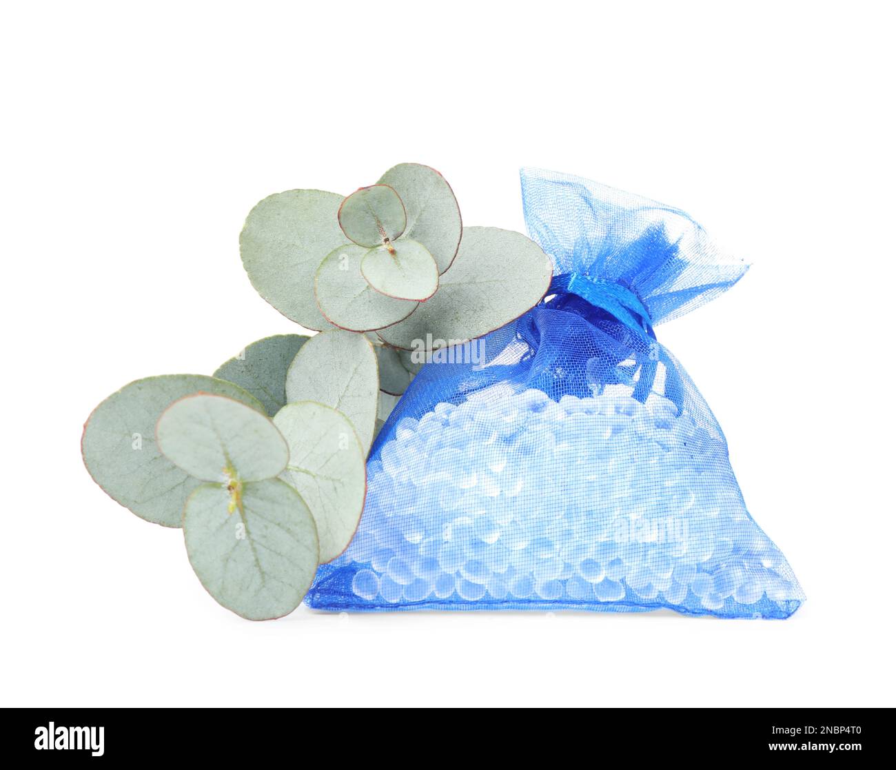Scented sachet with aroma beads and eucalyptus branches on white ...