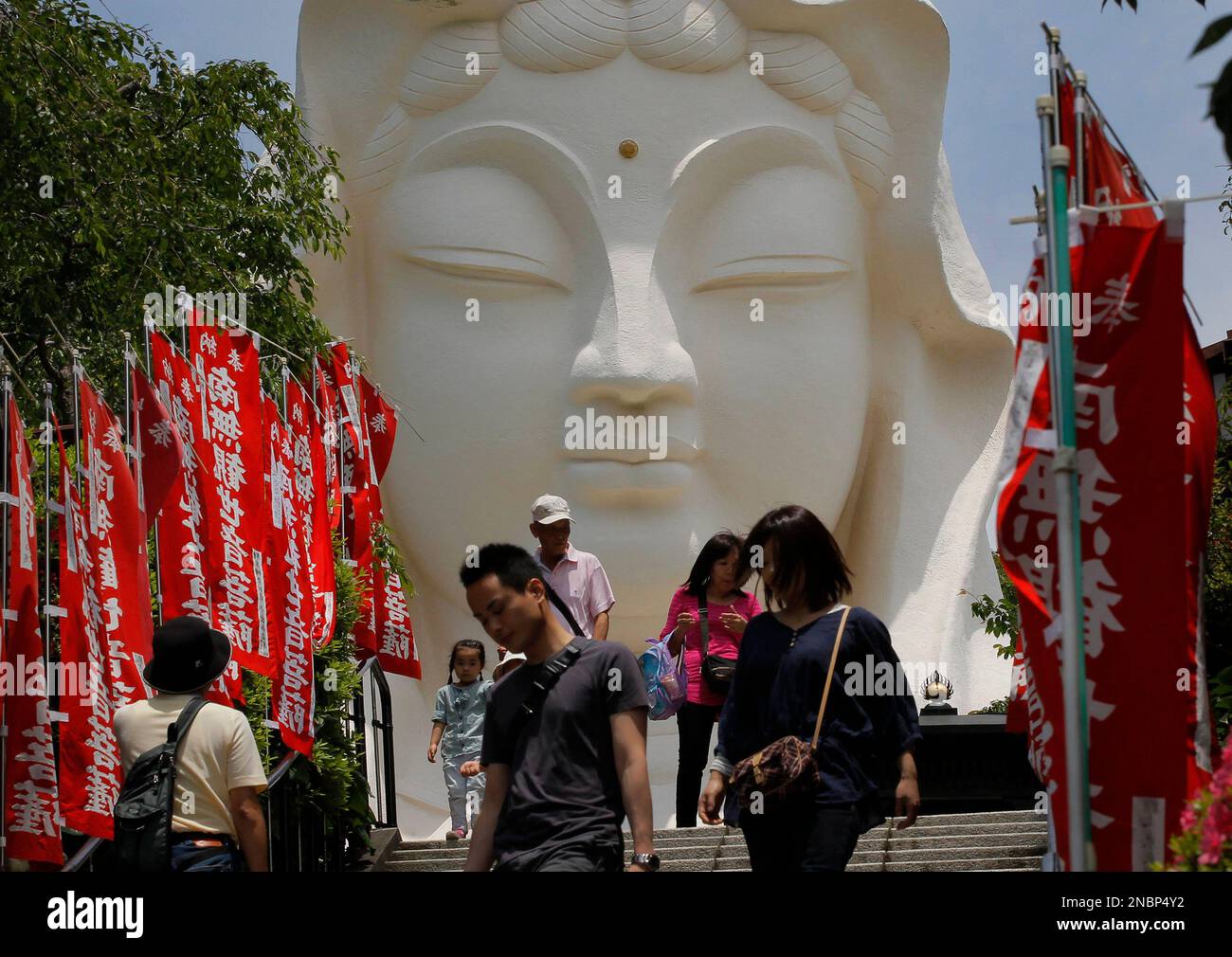 Tourists visit the Ofuna Kannon, or Goddess of Mercy, in Ofuna, south ...