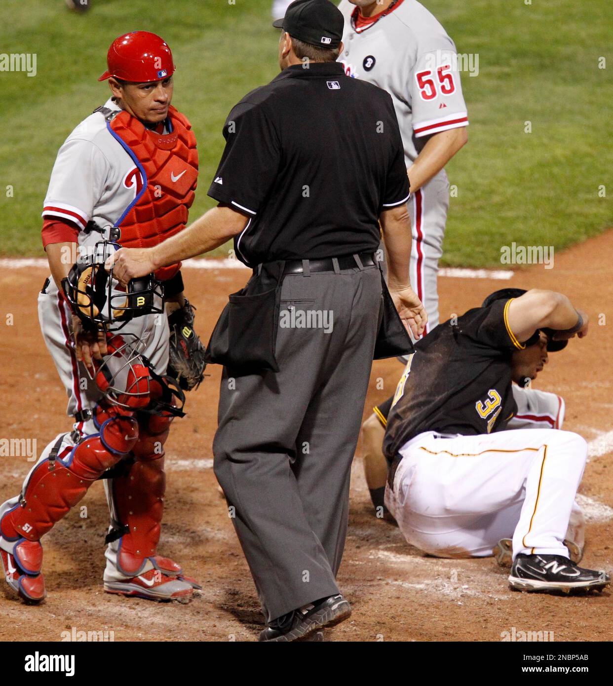 Pittsburgh Pirates' Xavier Paul, lower right, gets up after being ...