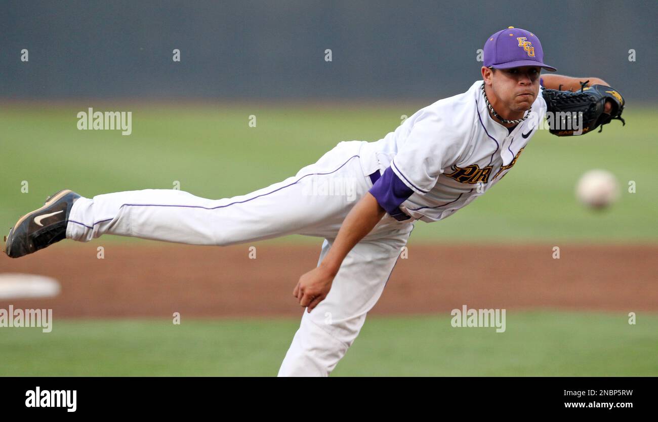 East carolina relief pitcher Seth Simmons stretches across after ...
