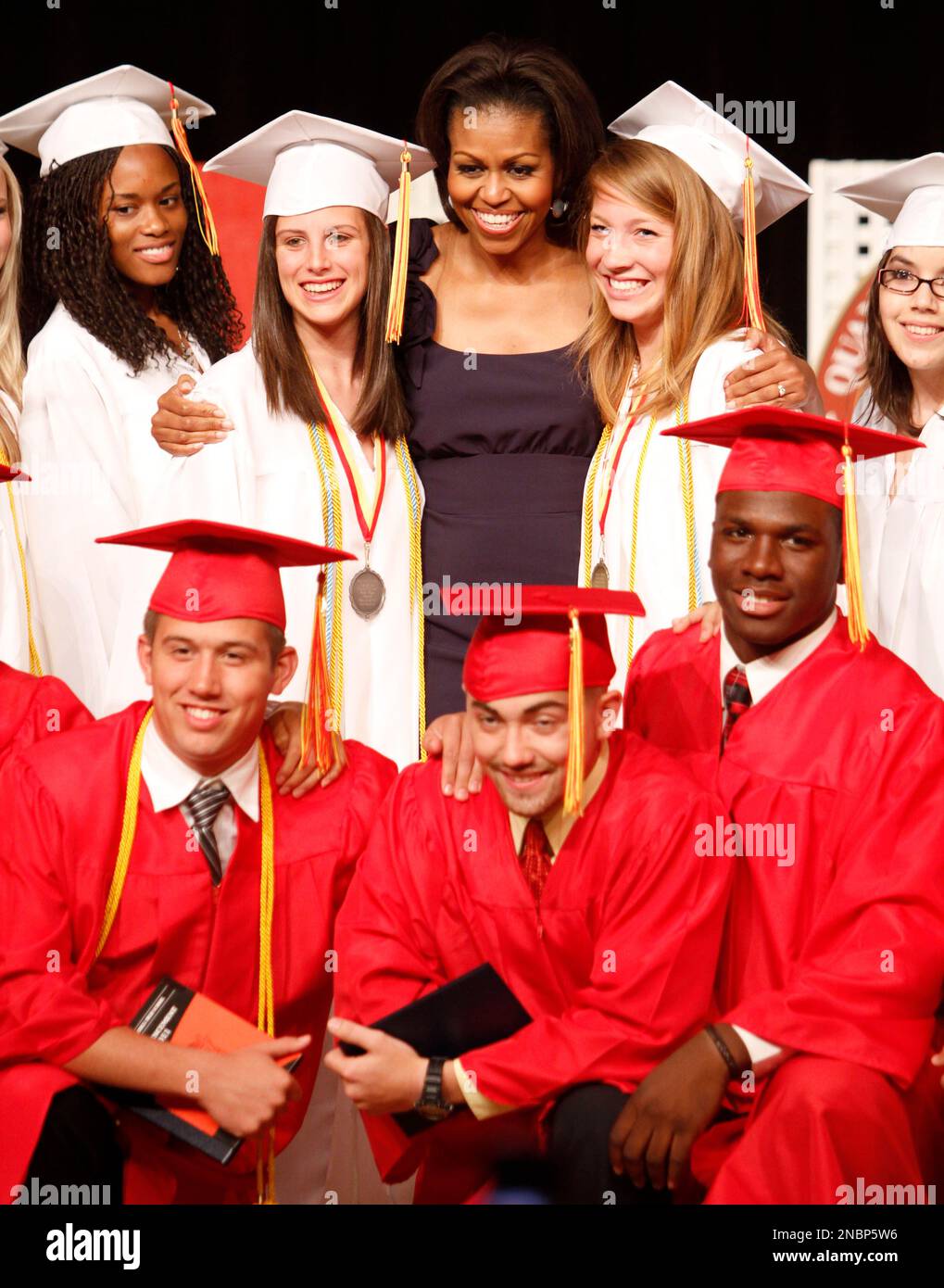 First lady Michelle Obama poses with graduates after commencement ...