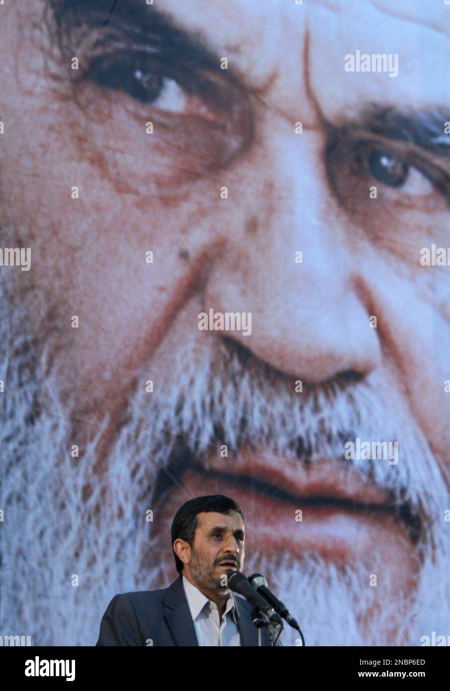 Iranian President Mahmoud Ahmadinejad, addresses a crowd, in front of a ...
