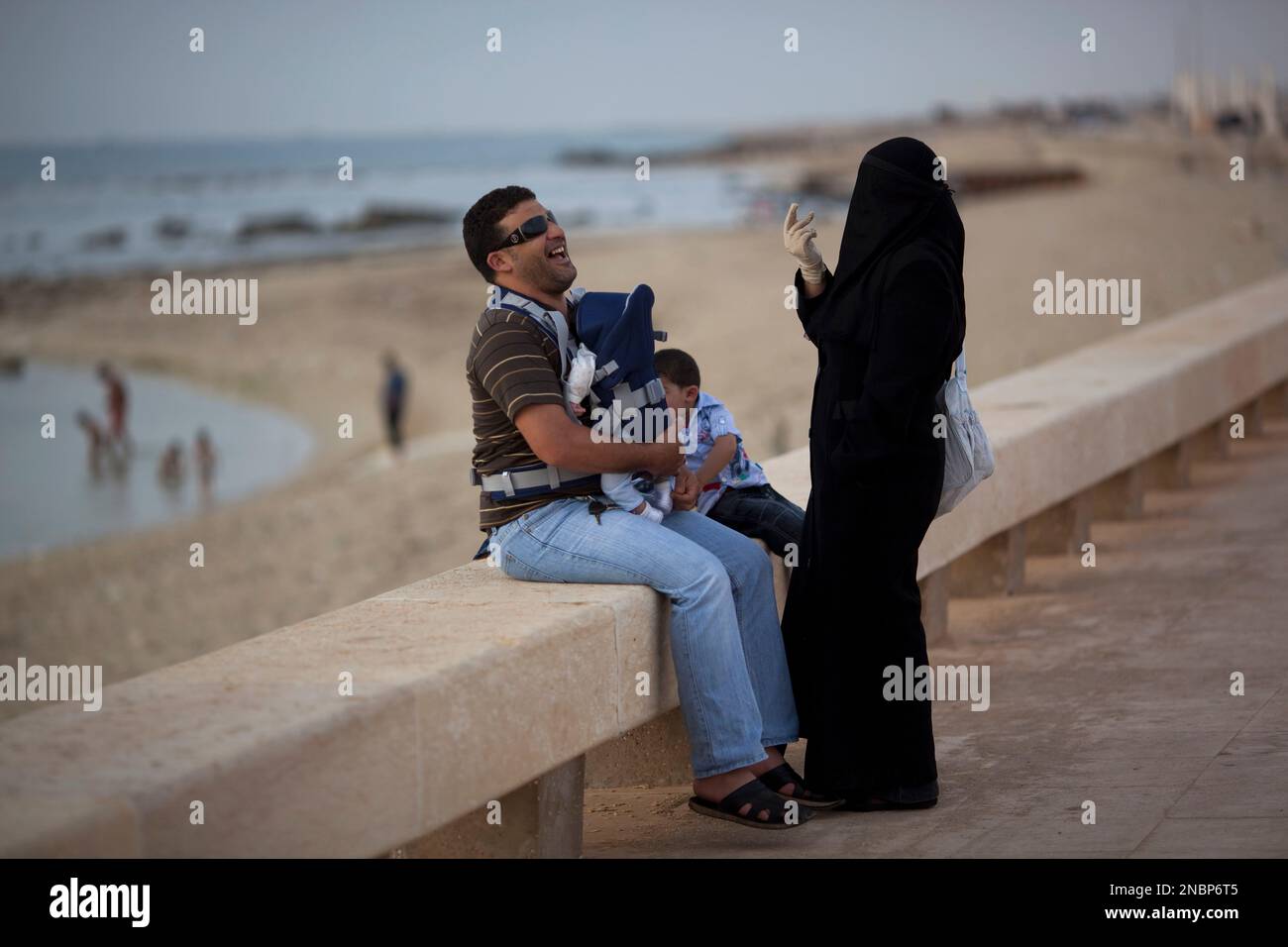 A family relaxes on the beach in Benghazi, Libya, Friday June 3, 2011 ...
