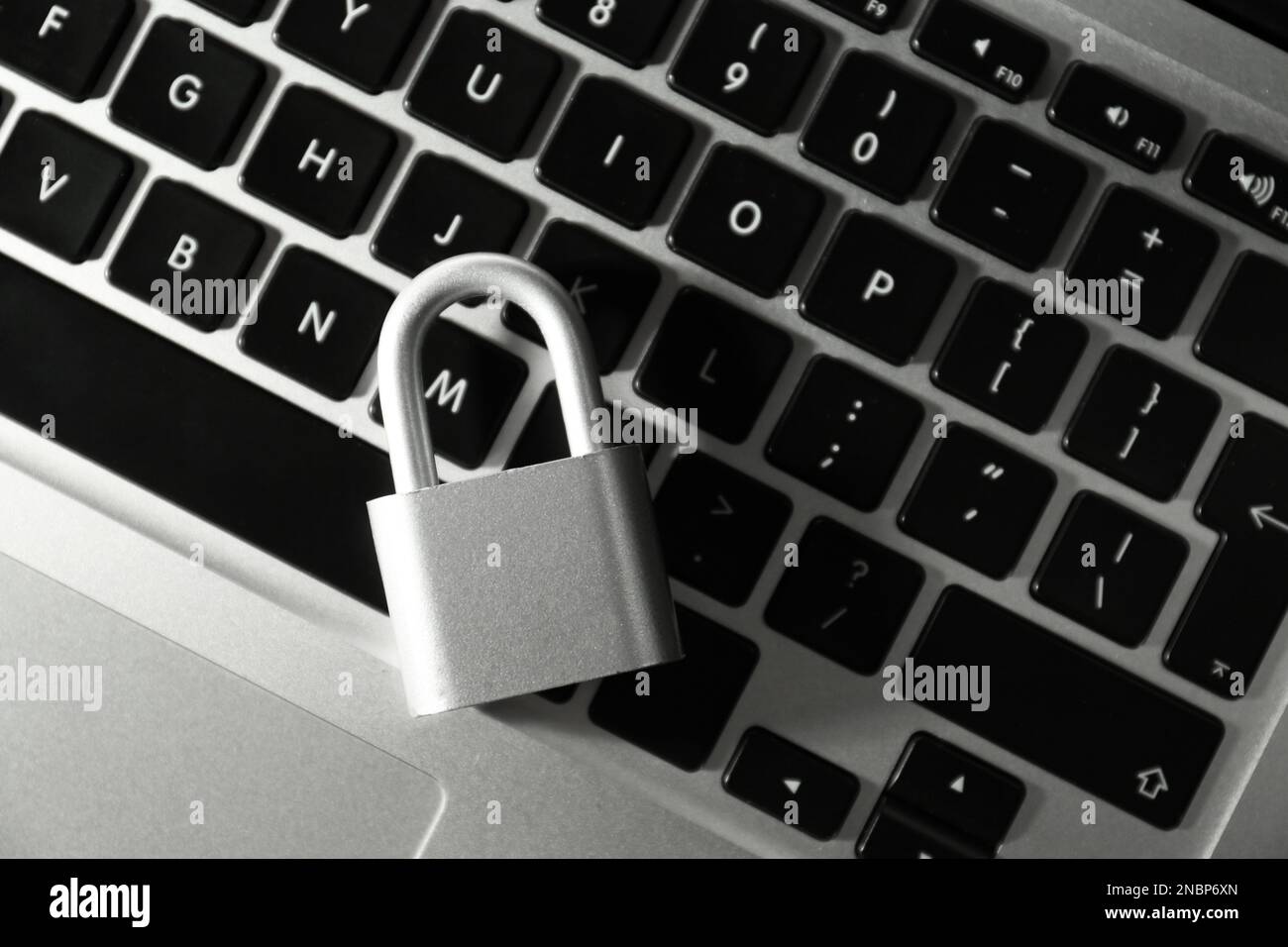 Metal lock on laptop, top view. Cyber security concept Stock Photo - Alamy