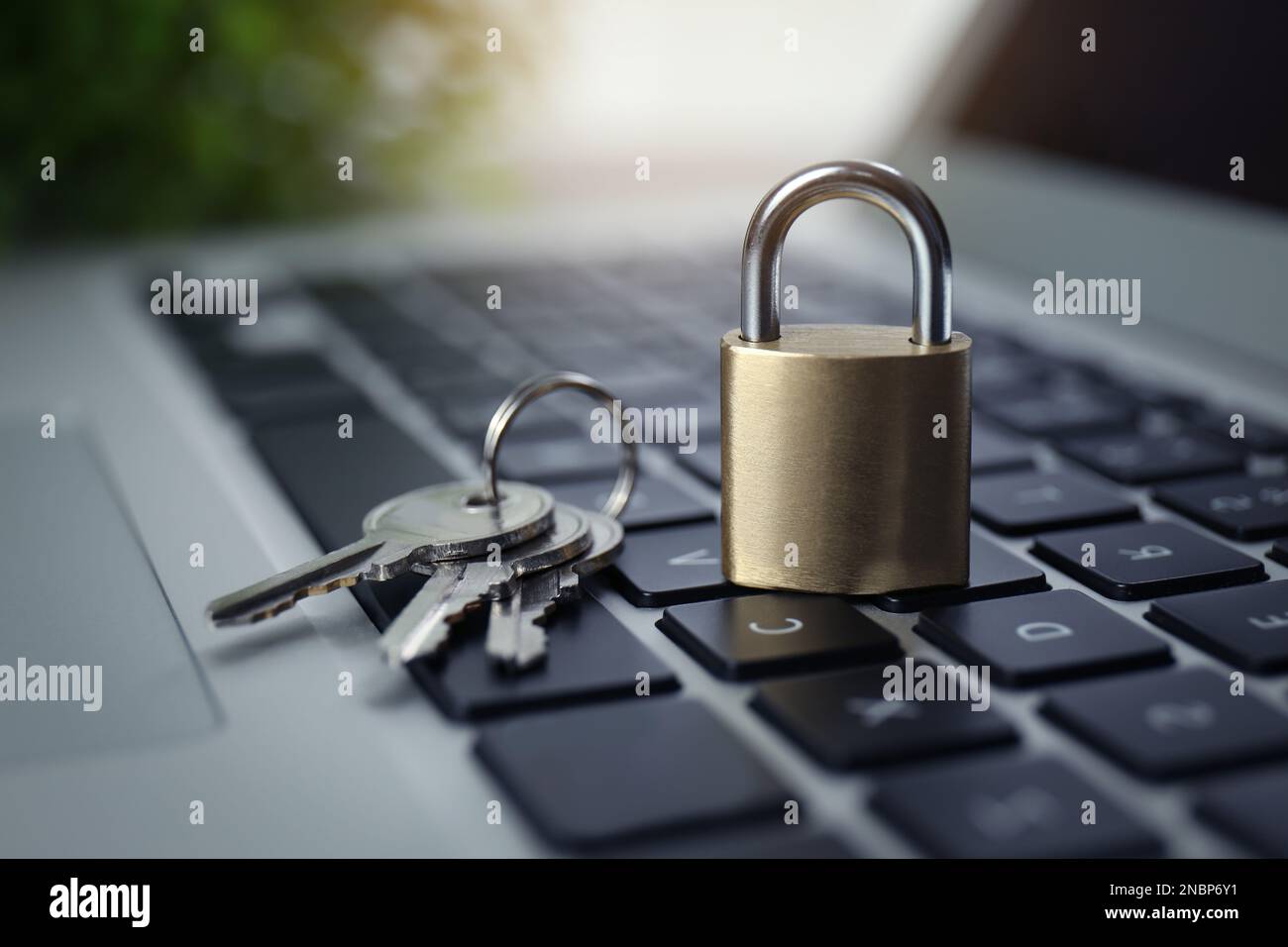 Metal padlock and keys on laptop keyboard, closeup. Cyber security ...