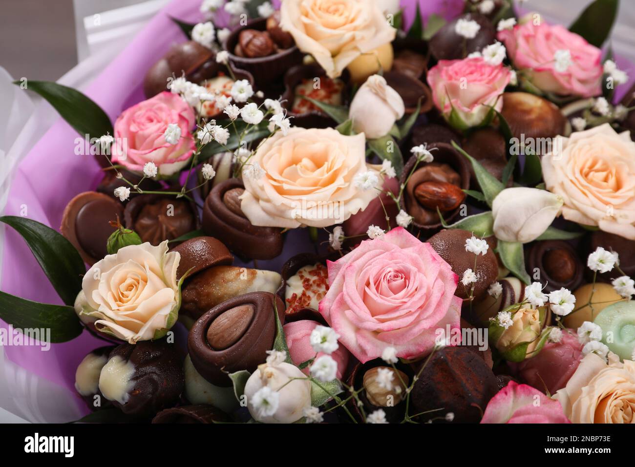 Beautiful food bouquet of sweets and flowers, closeup Stock Photo - Alamy