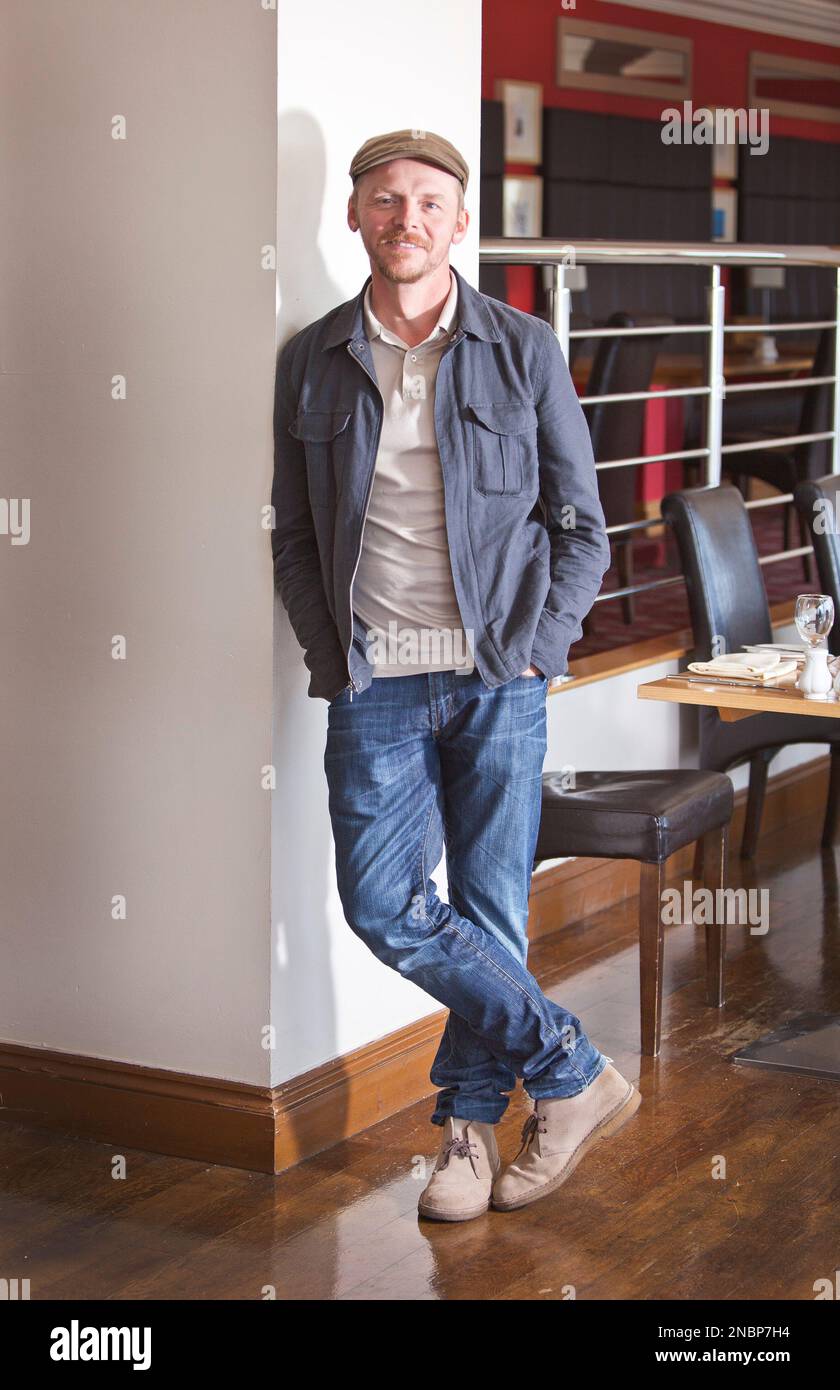 British actor Simon Pegg poses for photographs following an interview ...