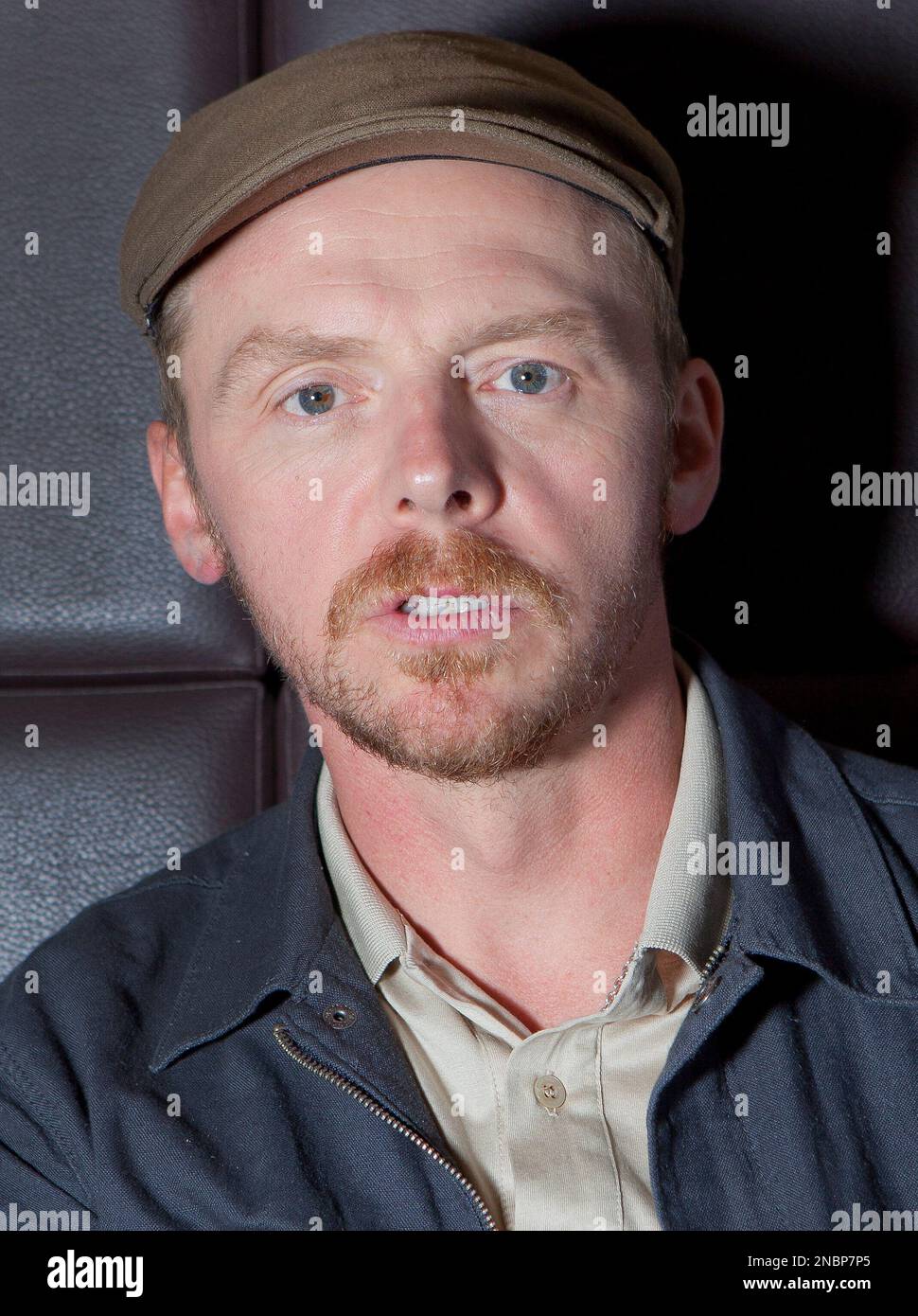 British actor Simon Pegg poses for photographs following an interview ...