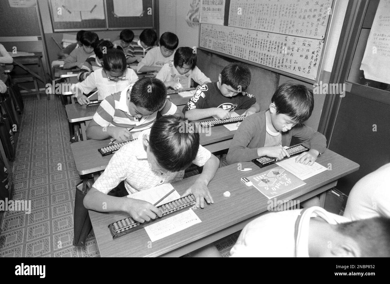 Students are taught how to work with an abacus in a private school in ...