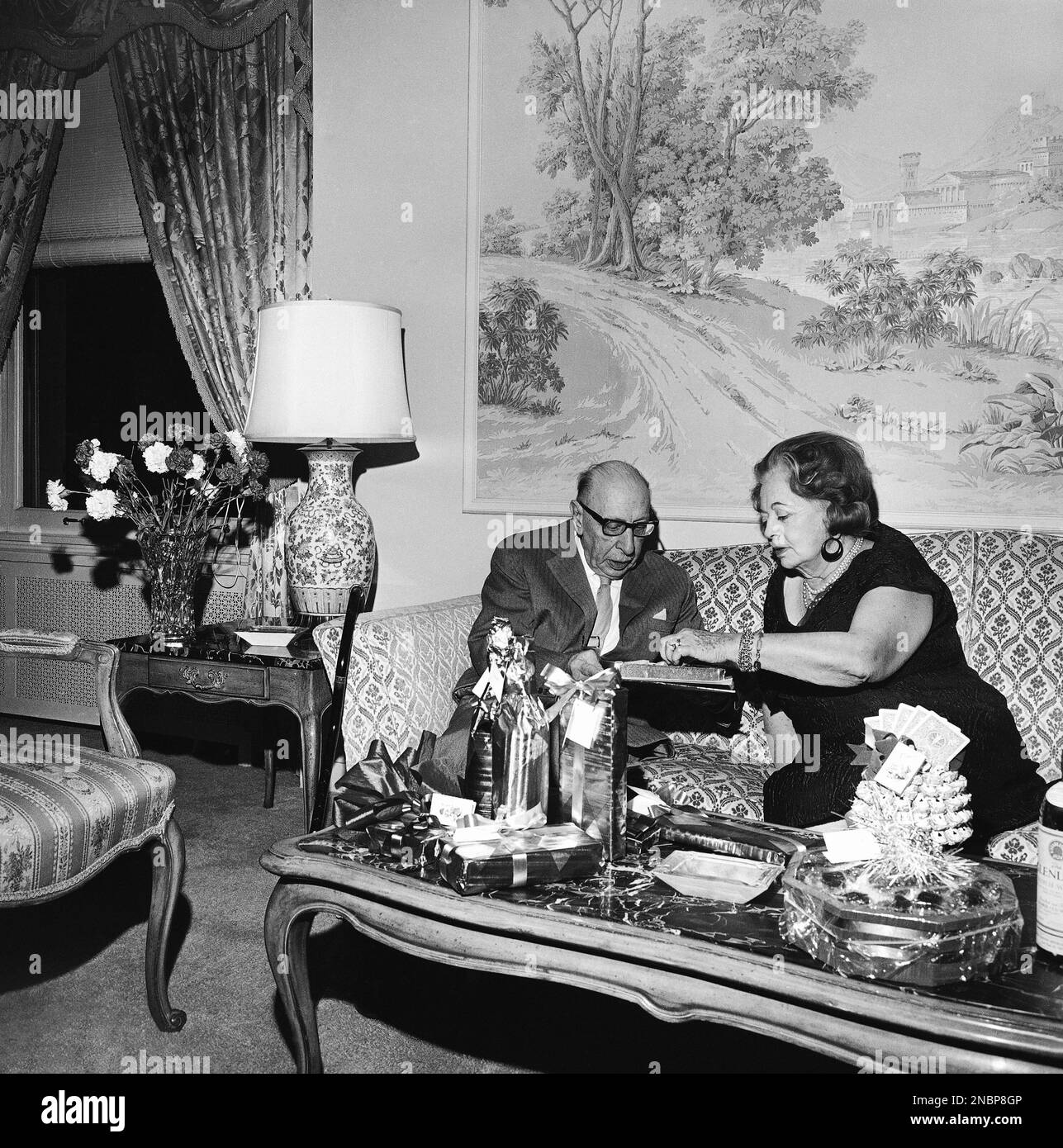 Famed composer Igor Stravinsky presents his wife, Vera, with a double ...