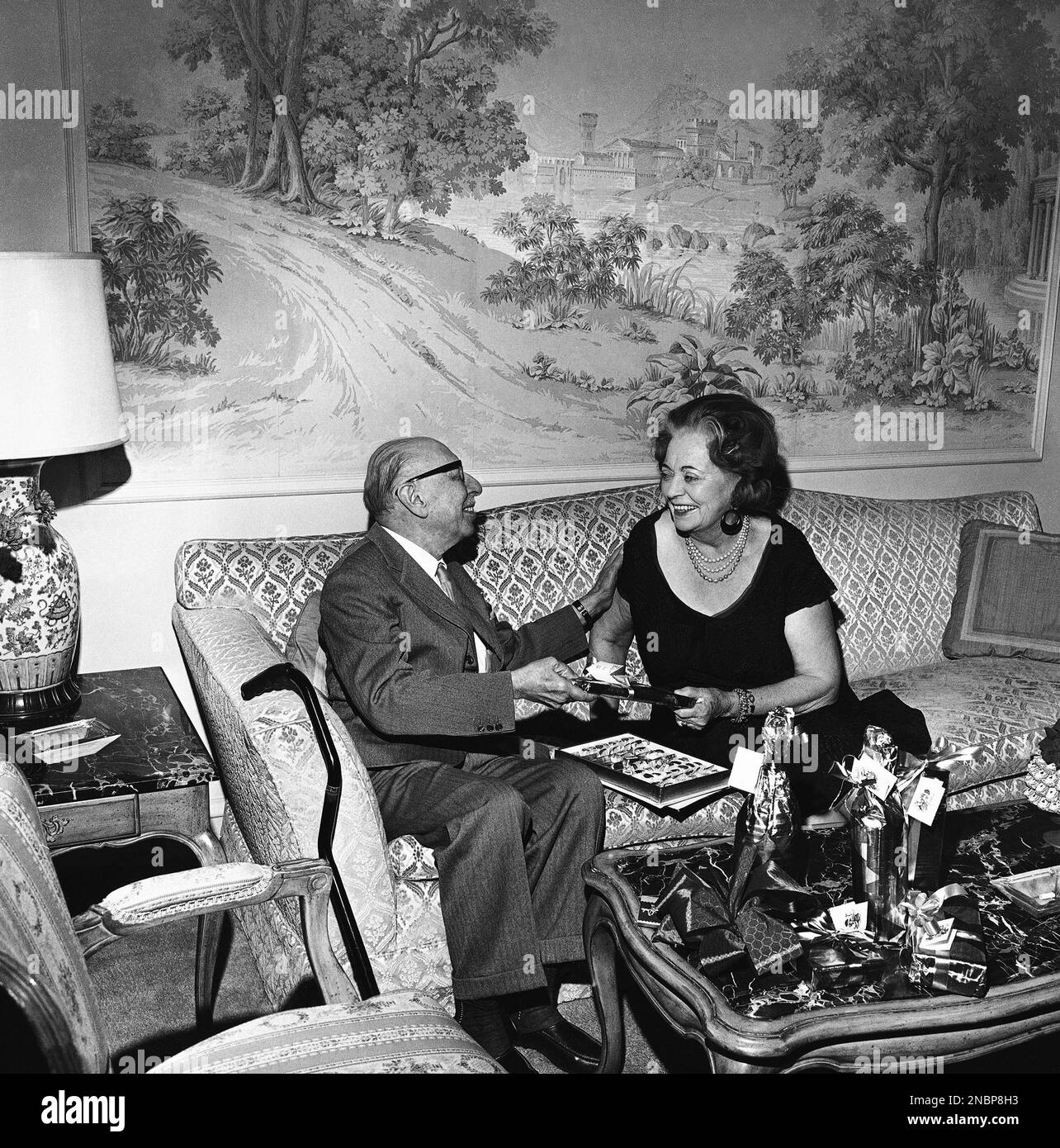 Famed composer Igor Stravinsky presents his wife, Vera, with a double ...