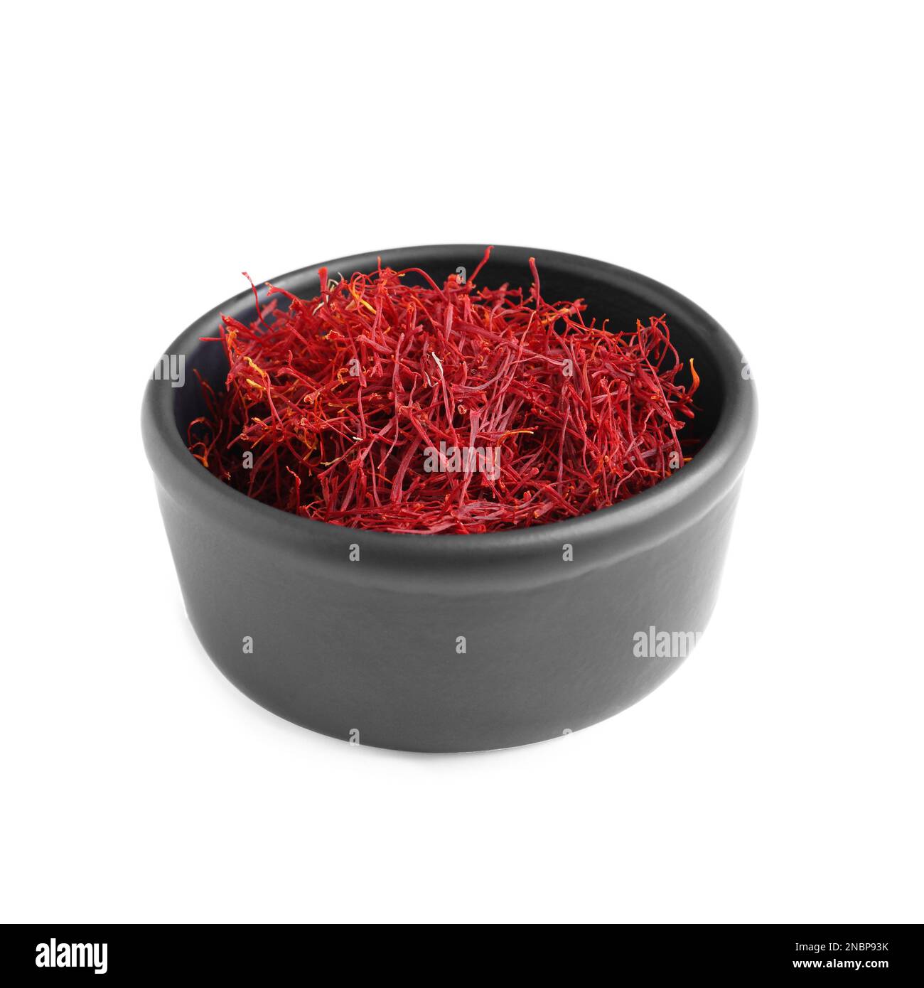 Dried saffron in bowl isolated on white Stock Photo - Alamy