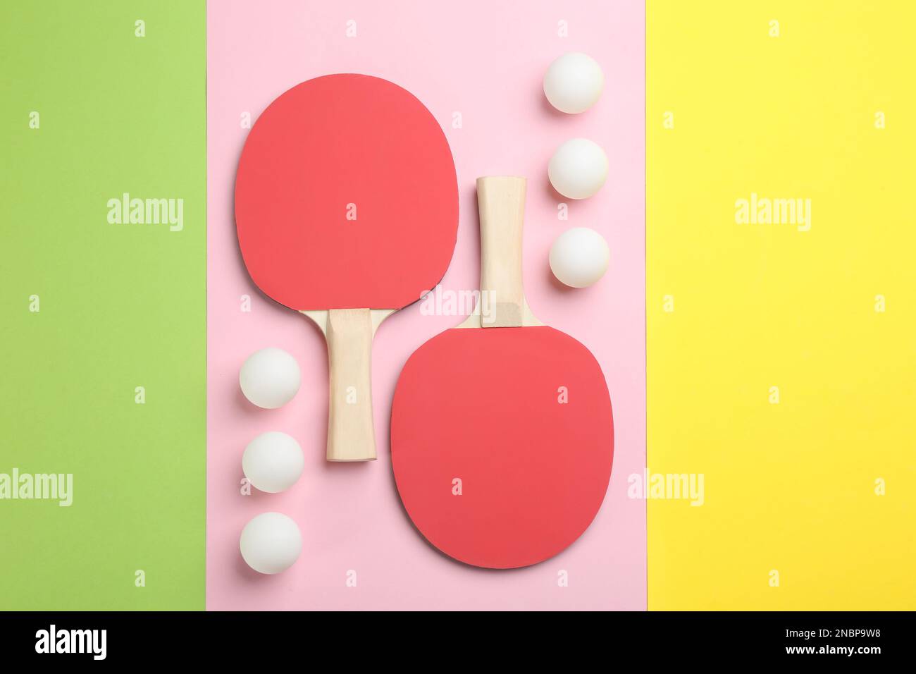 Ping pong rackets and balls on color background, flat lay Stock Photo ...