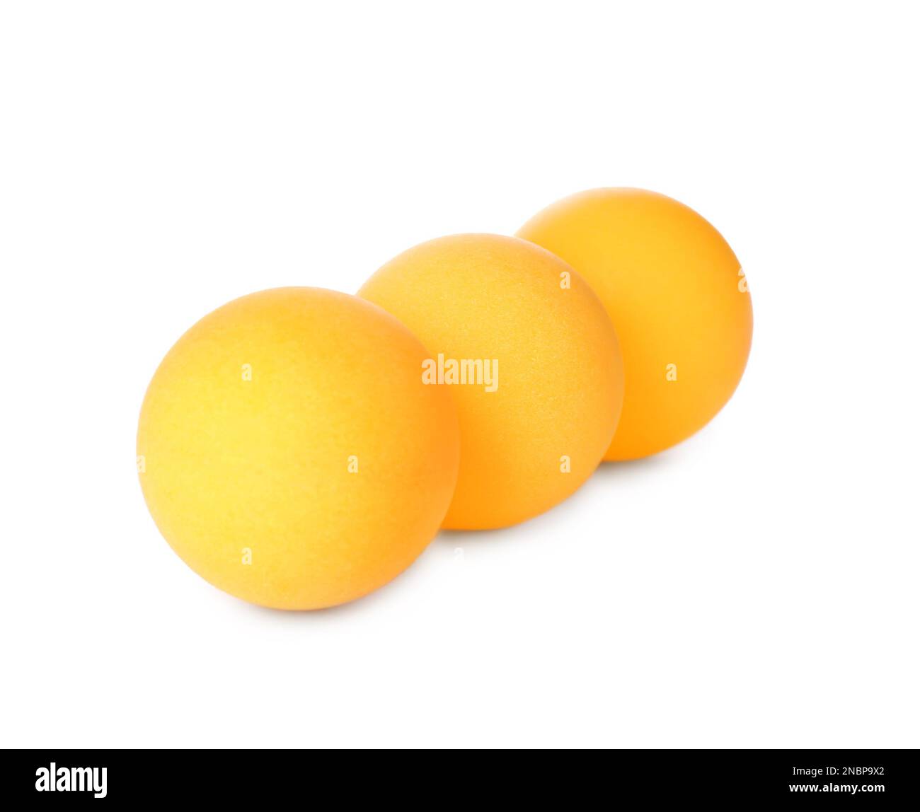 Orange ping pong balls isolated on white Stock Photo - Alamy