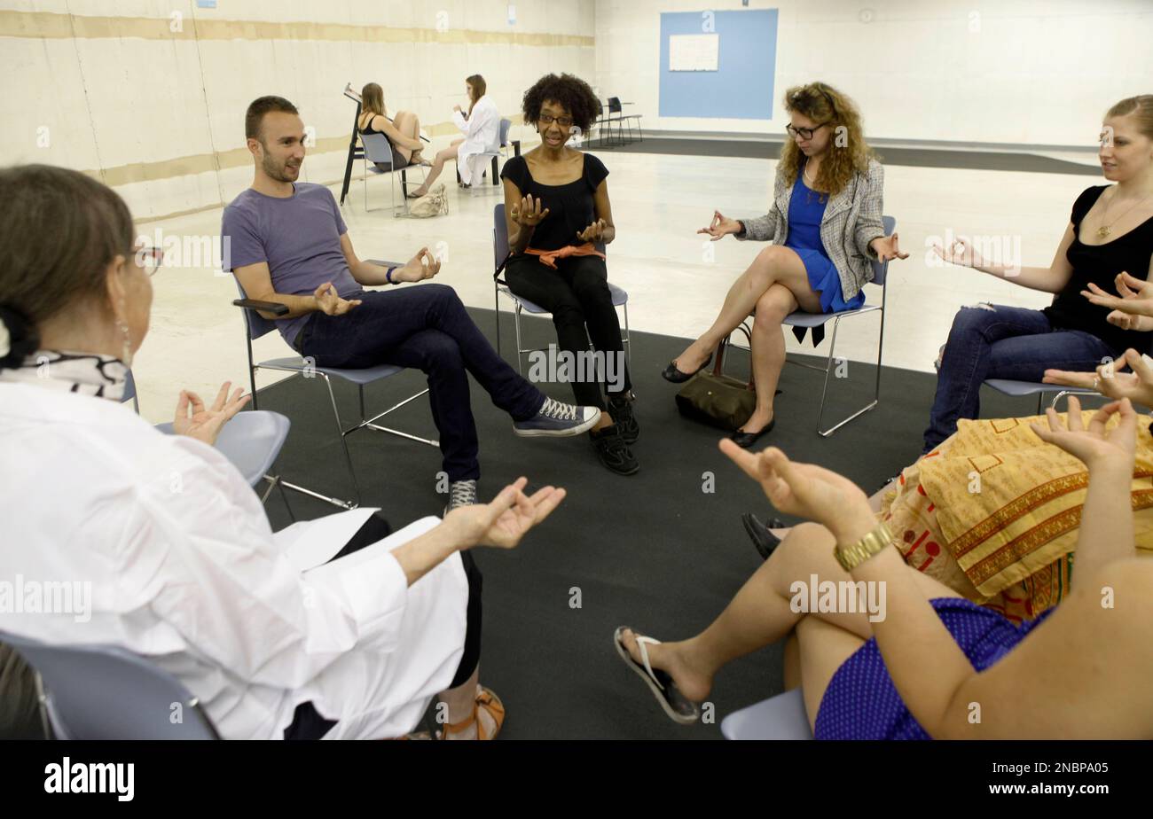 Curator David van der Leer, second from left, leads volunteers as they ...