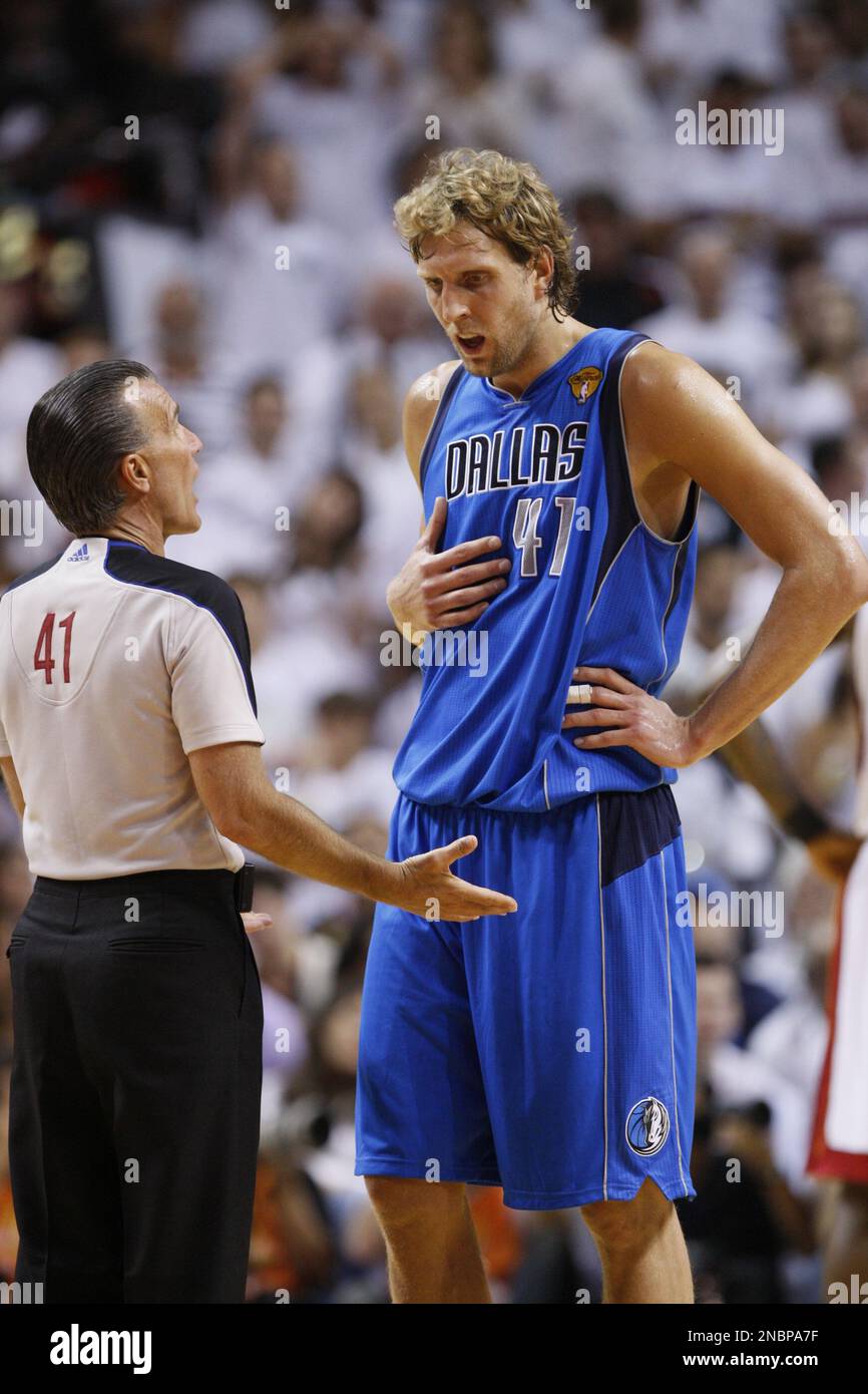 Dallas Mavericks' Dirk Nowitzki (41) speaks with referee Ken Mauer (41 ...