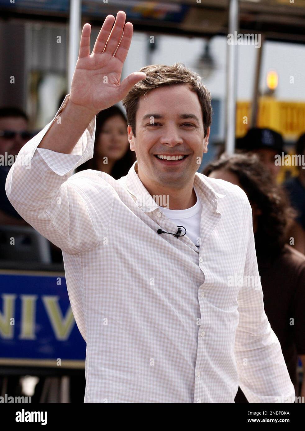 Comedian Jimmy Fallon waves after performing "Tram-tastic" at Universal ...