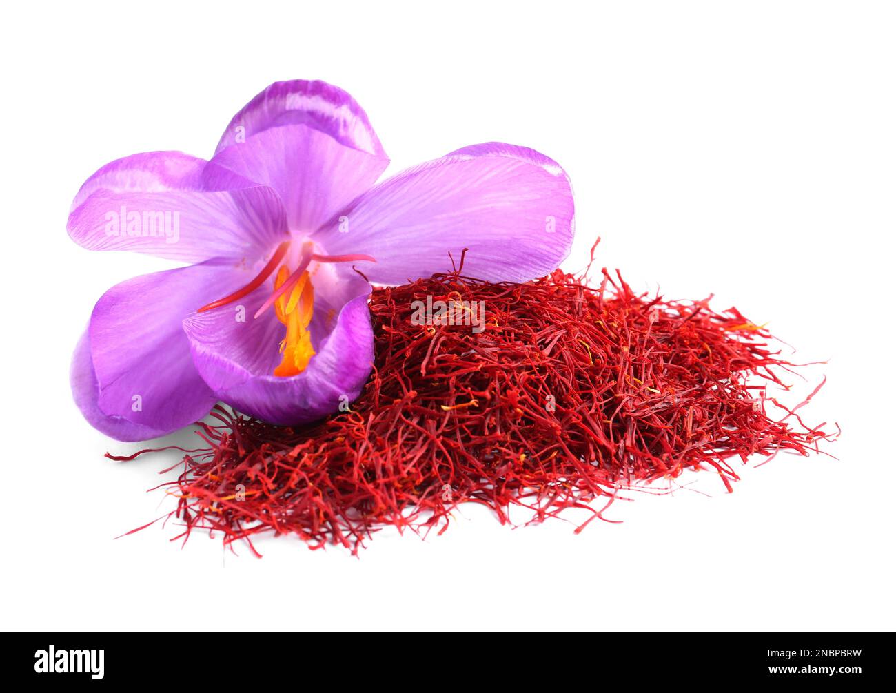 Pile of dried saffron and crocus flower on white background Stock Photo ...