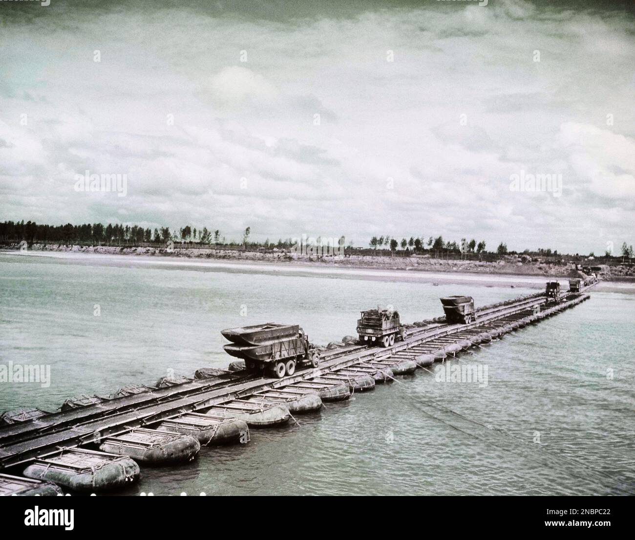 Fifth Army crossing a Pontoon Bridge during World War II in 1944. (AP ...