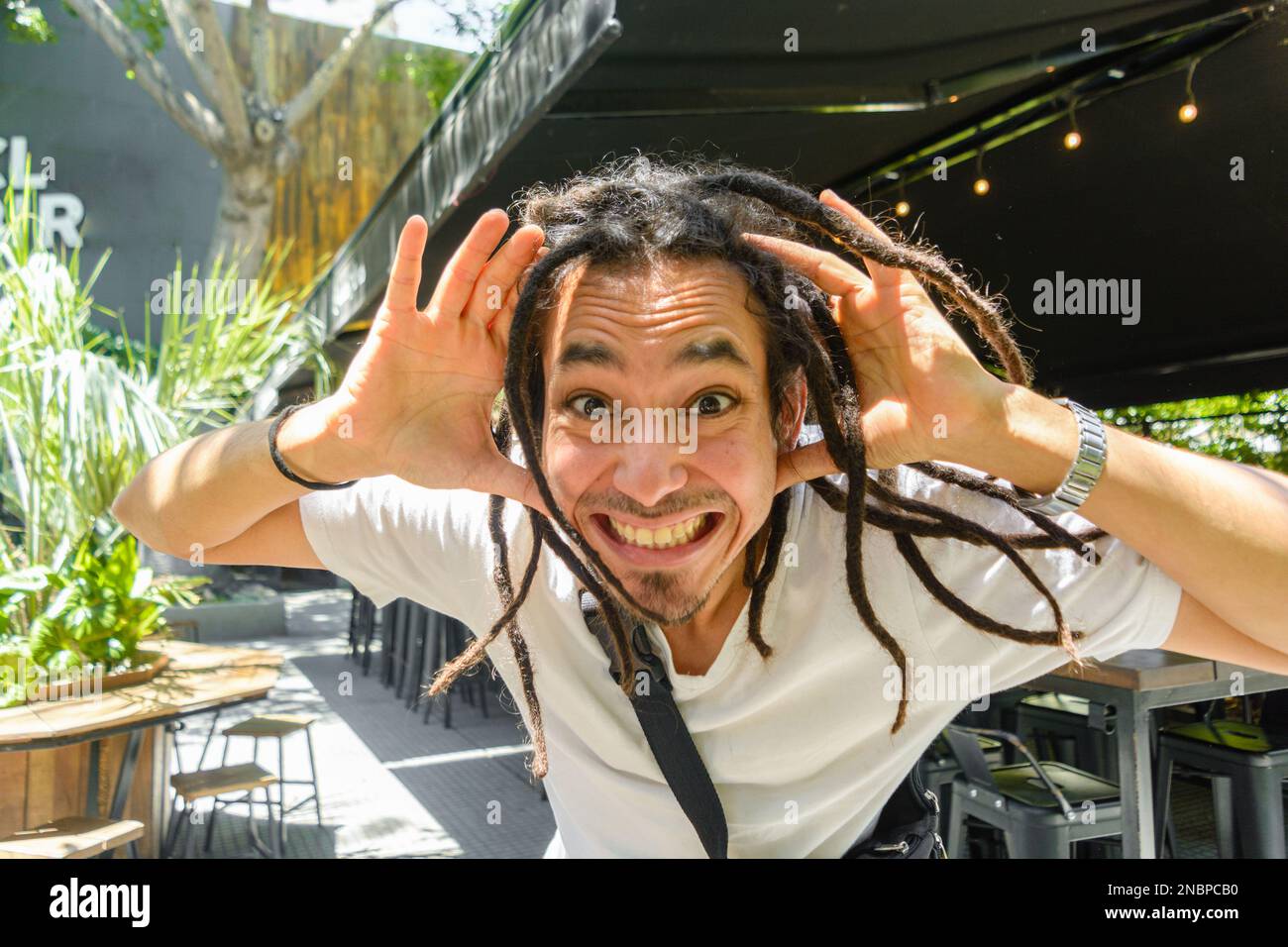 young latino man with dreadlocks of venezuelan ethnicity, he is ...