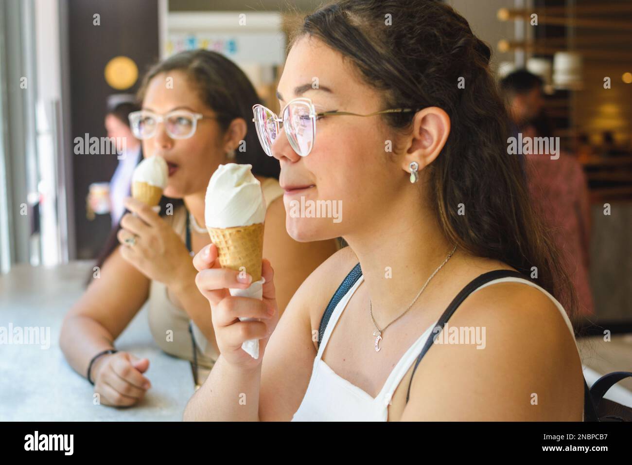 young latin woman of venezuelan ethnicity with glasses, calm enjoying ...
