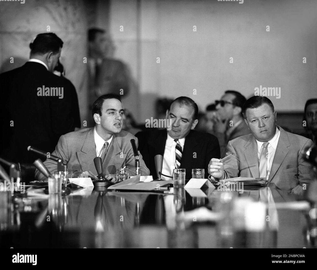 Roy Cohn, aide to Senator Joseph McCarthy (R-Wis.), asks a question in ...