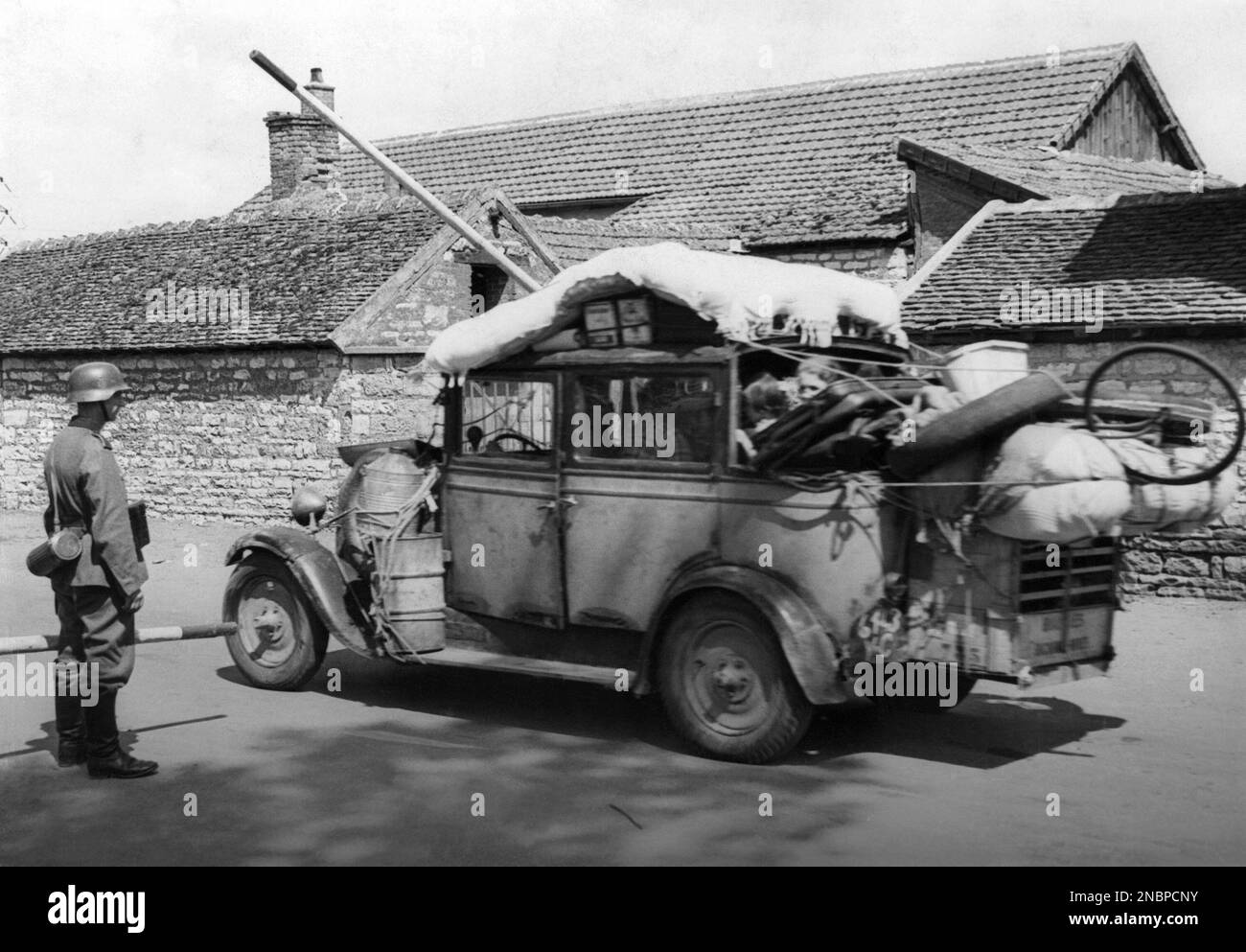 A fully loaded car passing the German border post on August 14, 1940 ...