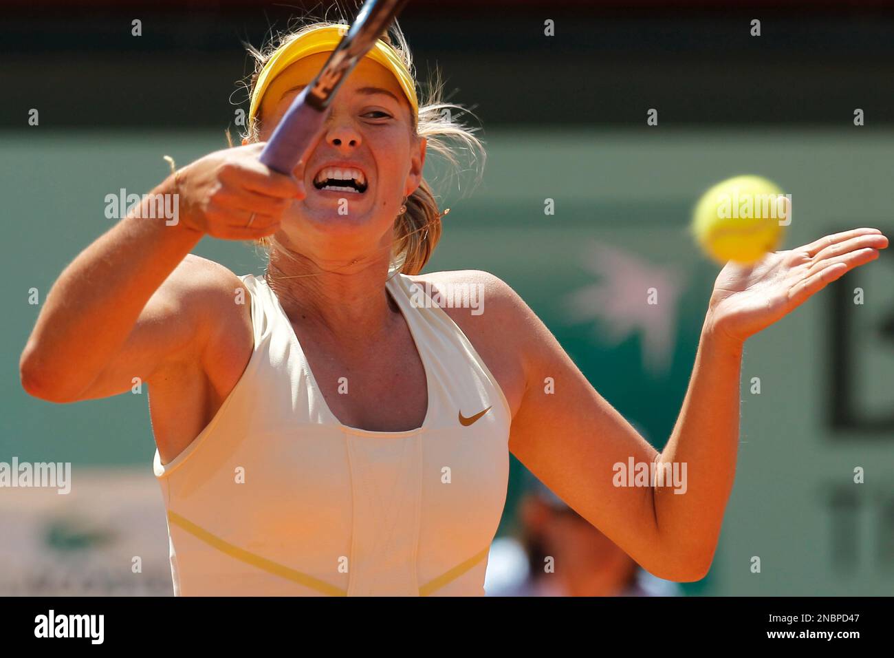 Maria Sharapova of Russia returns against Li Na of China in the semi ...