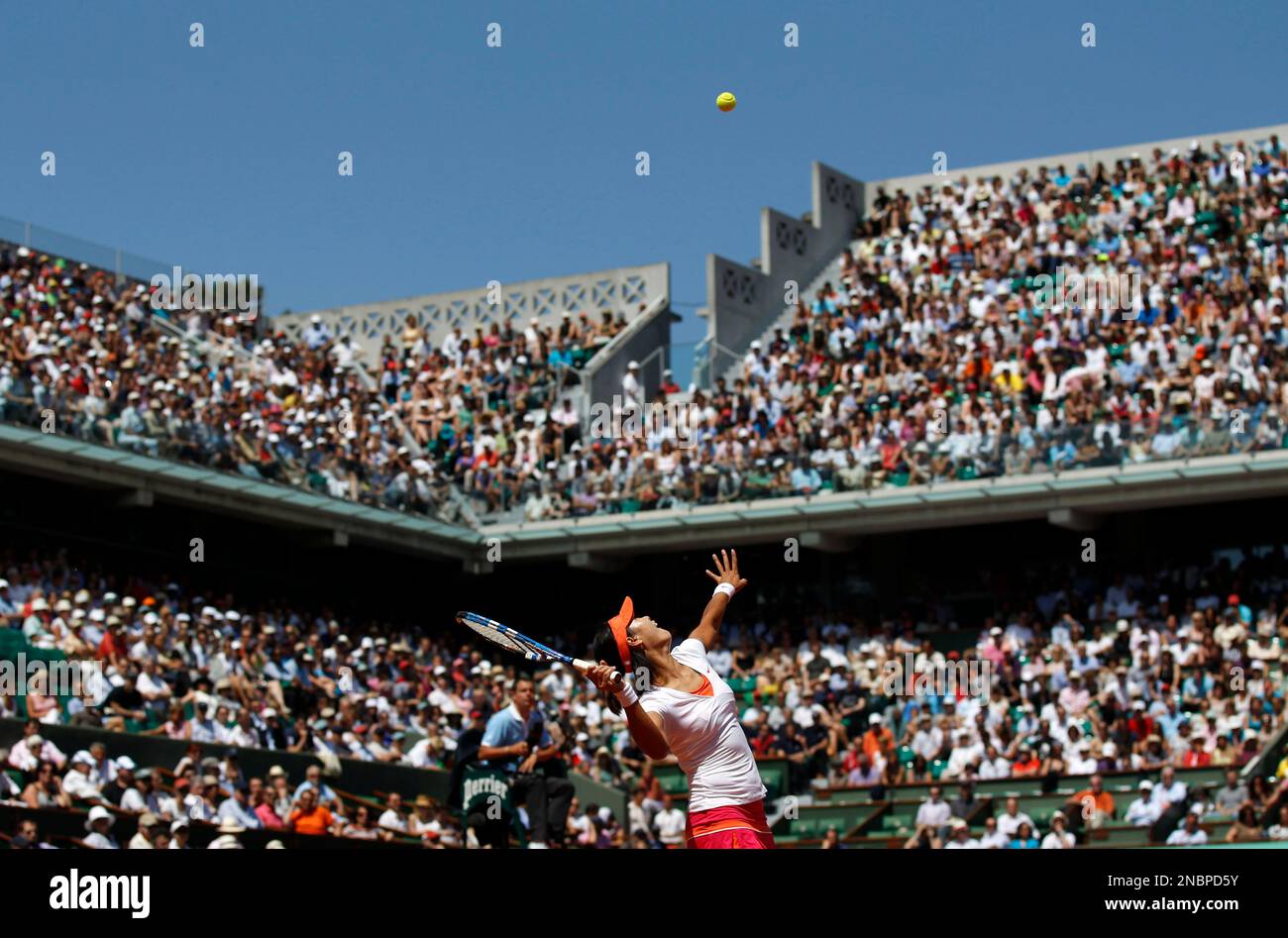 China's Li Na serves the ball to Russia's Maria Sharapova during their ...