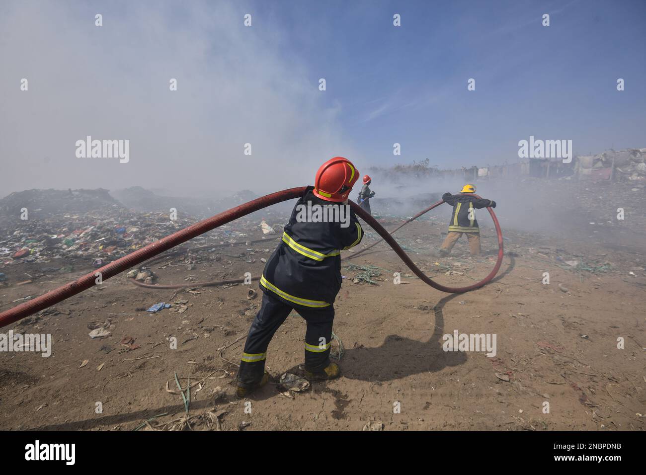 Nakuru, Kenya. 13th Feb, 2023. Firefighters attempt to extinguish fire ...