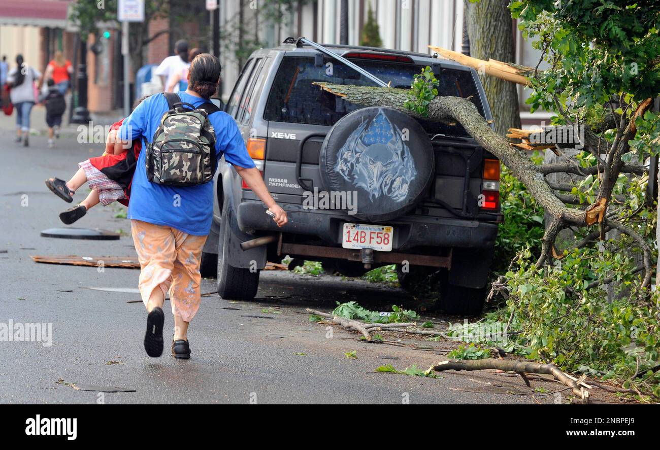 A woman runs with her child to safety after another report of a ...