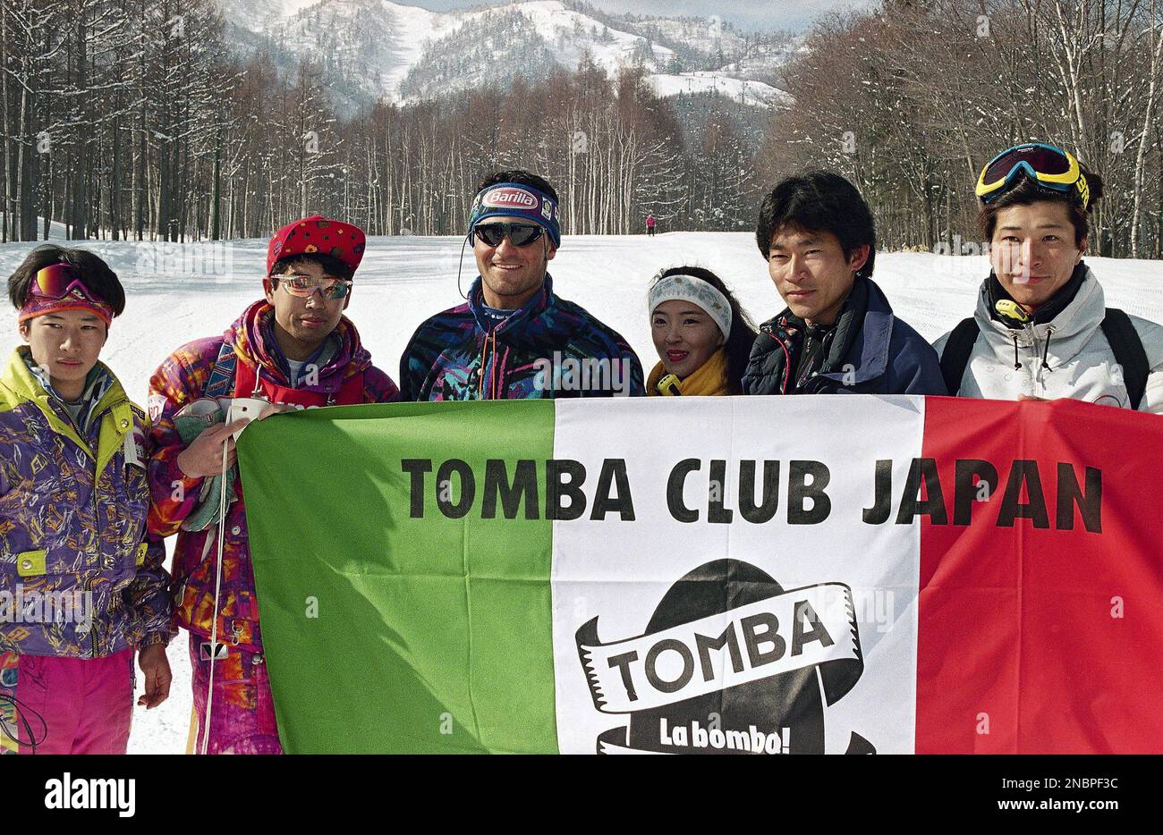 Italian ski ace Alberto Tomba flashes smile as he lines up with ...