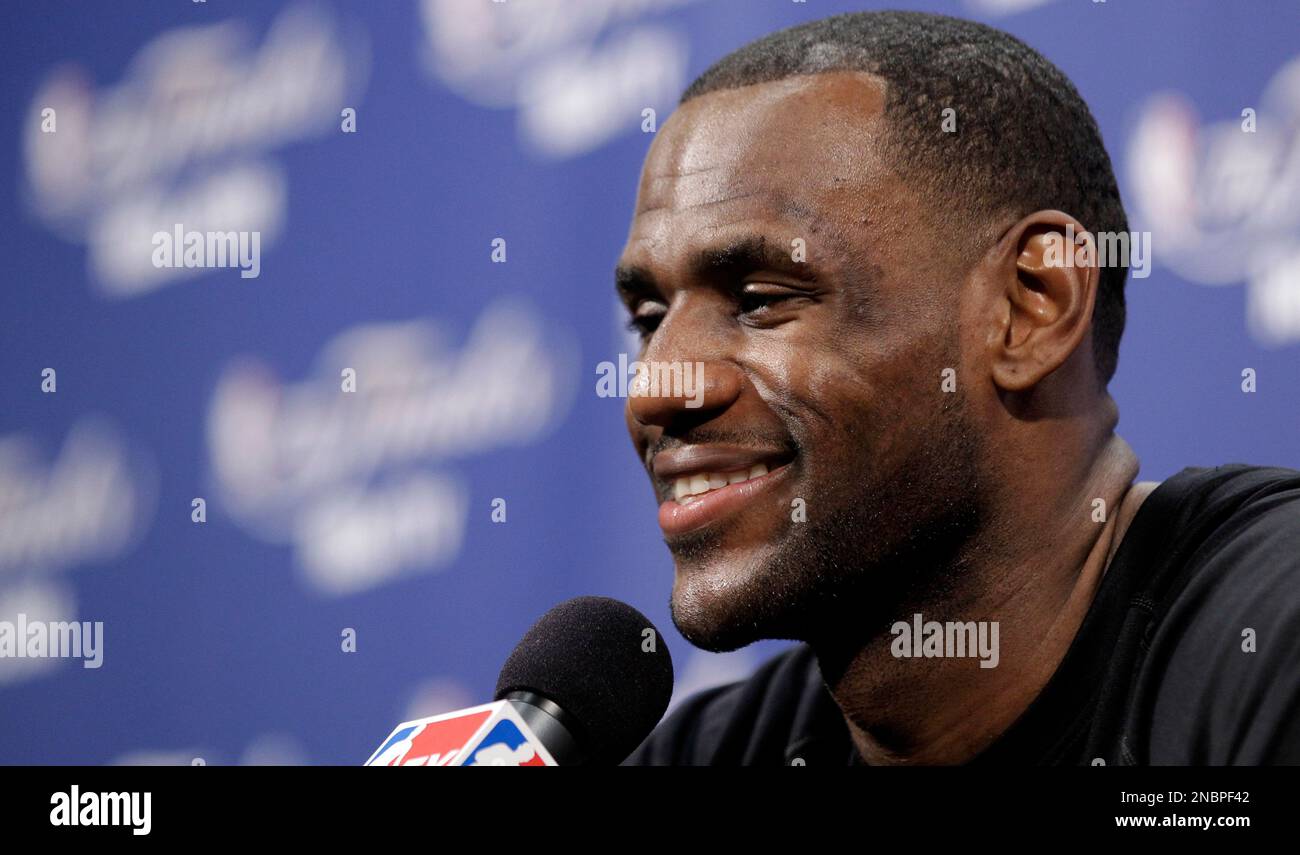 Miami Heat's LeBron James smiles as he answers a question after an NBA ...