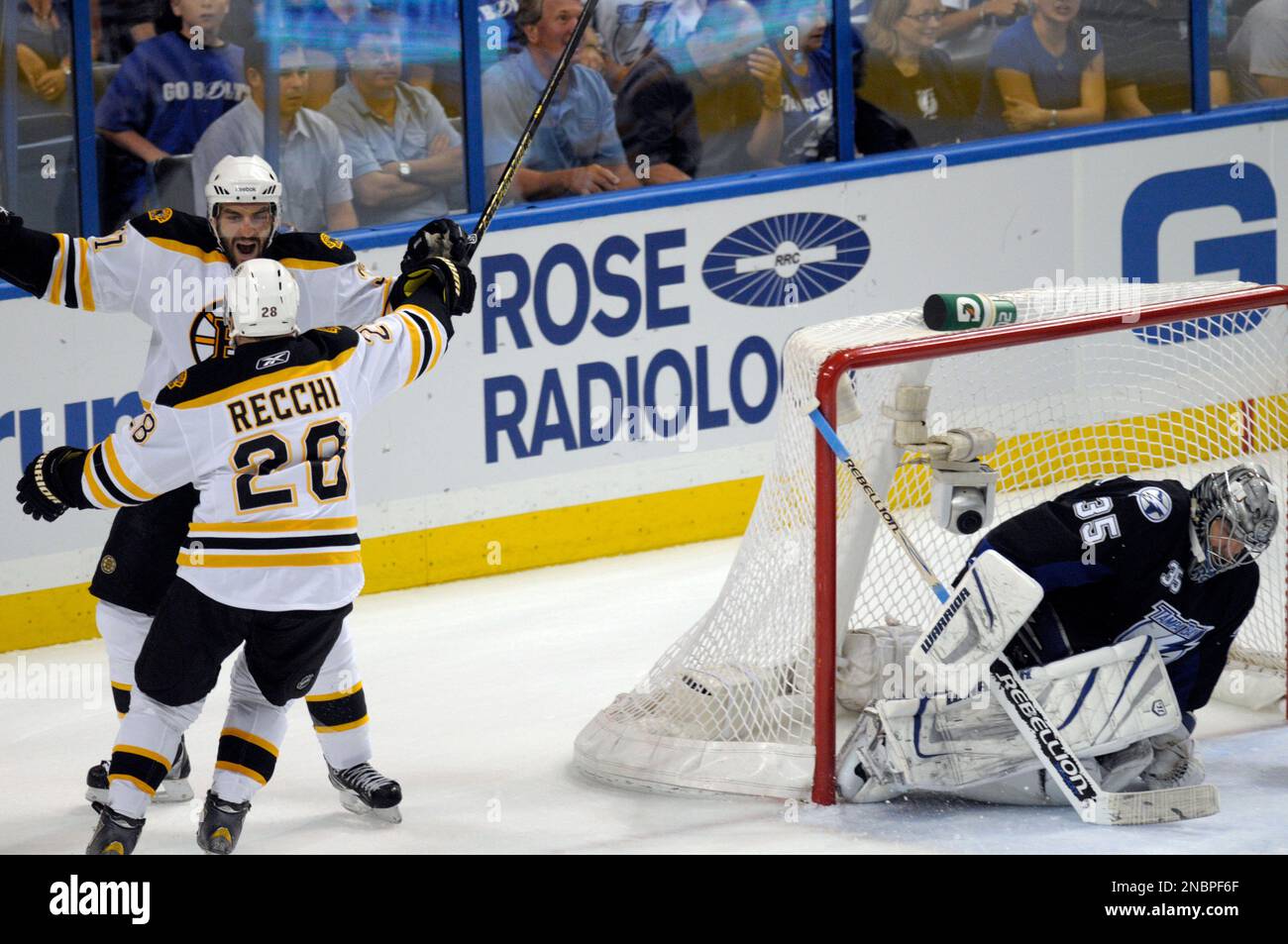 Boston Bruins' Patrice Bergeron is congratulated by teammate Mark ...