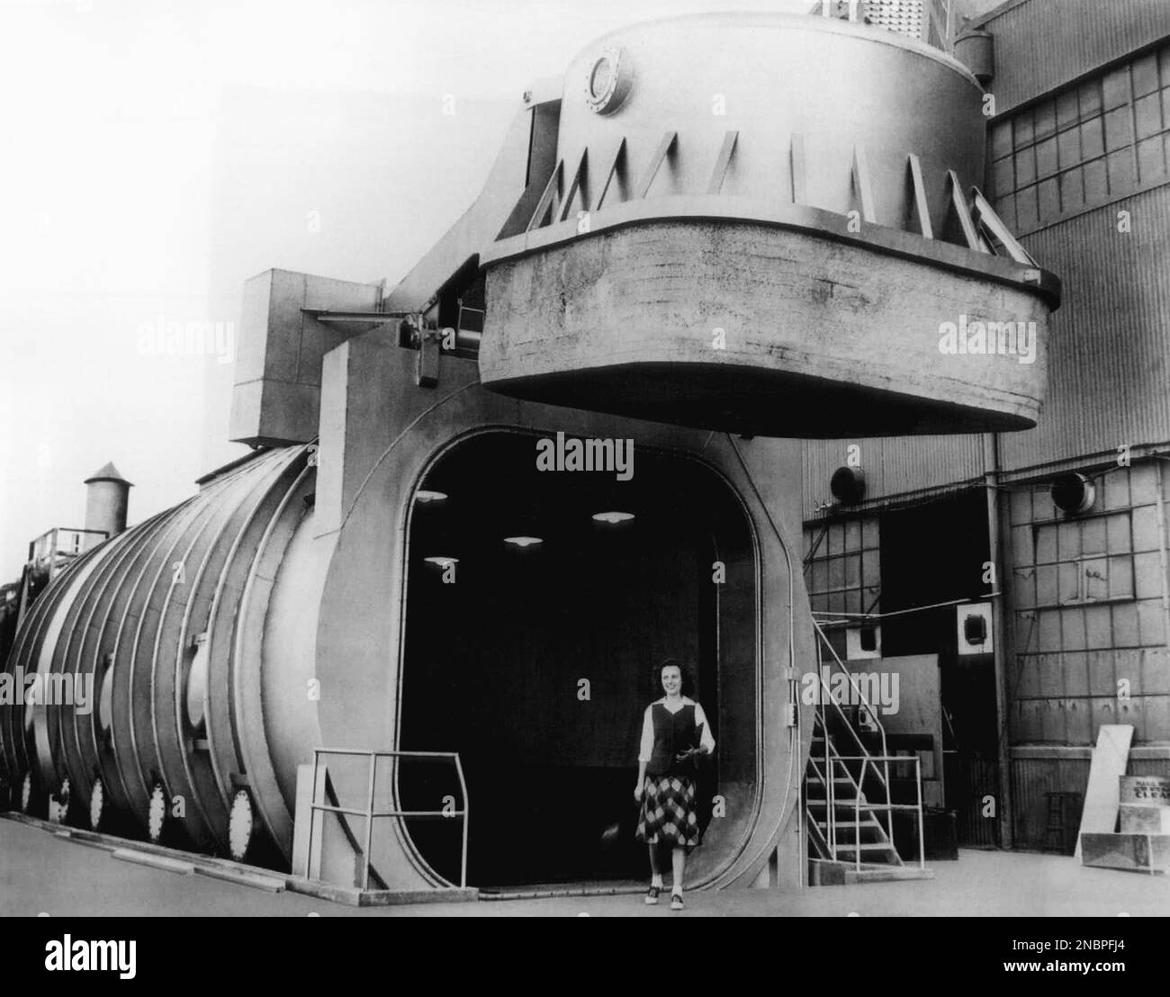 Ann Millar steps through the 12-foot opening for new cork-lined ...