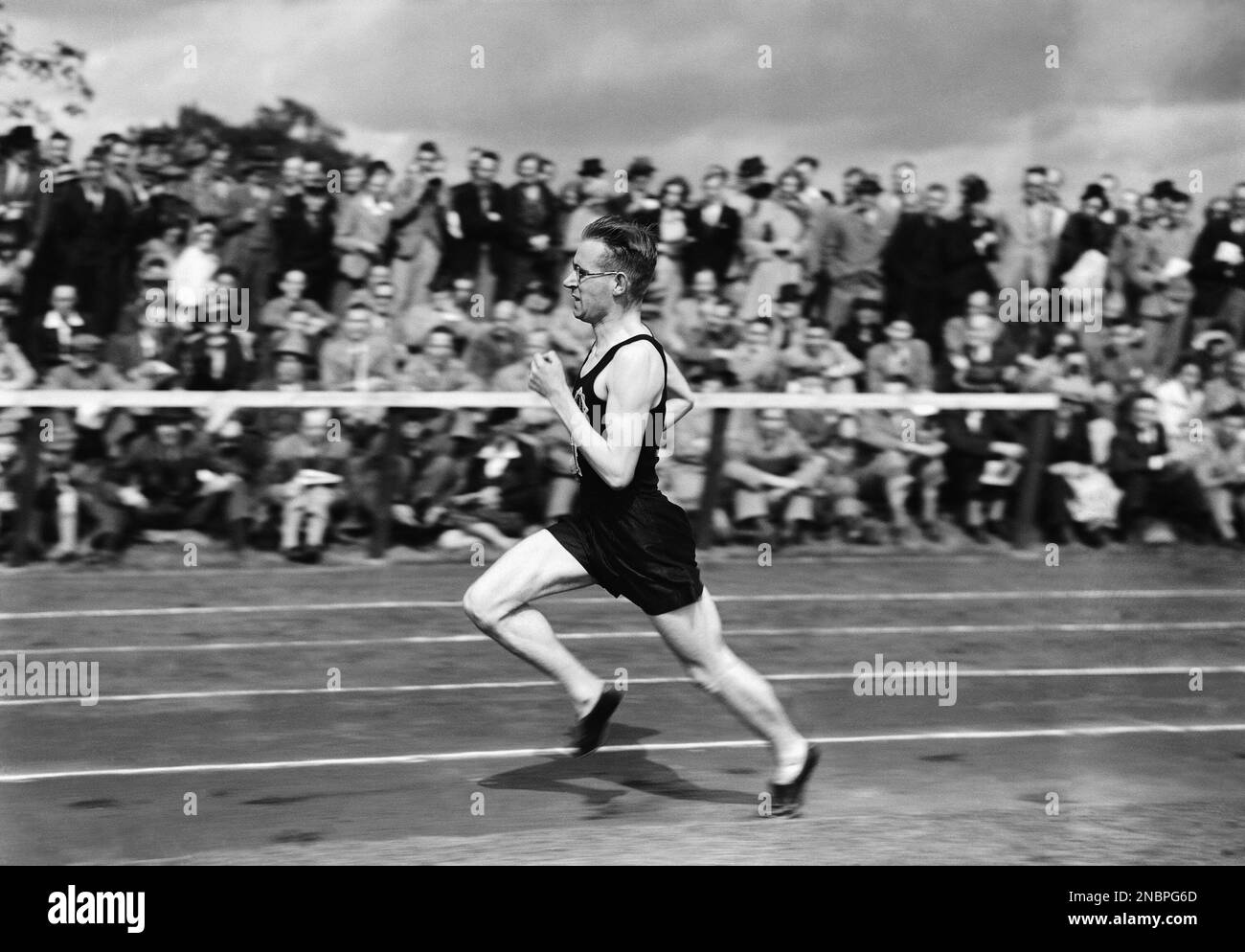 Sydney Wooderson, the famous British athlete, as he finished the mile ...