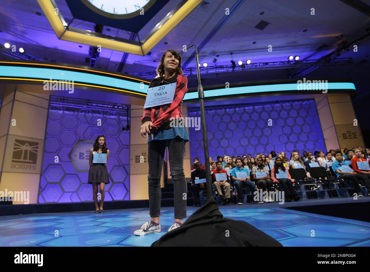 Talia Rose Ruiz, 12, from Santa Ana, Calif., center, reacts on spelling ...