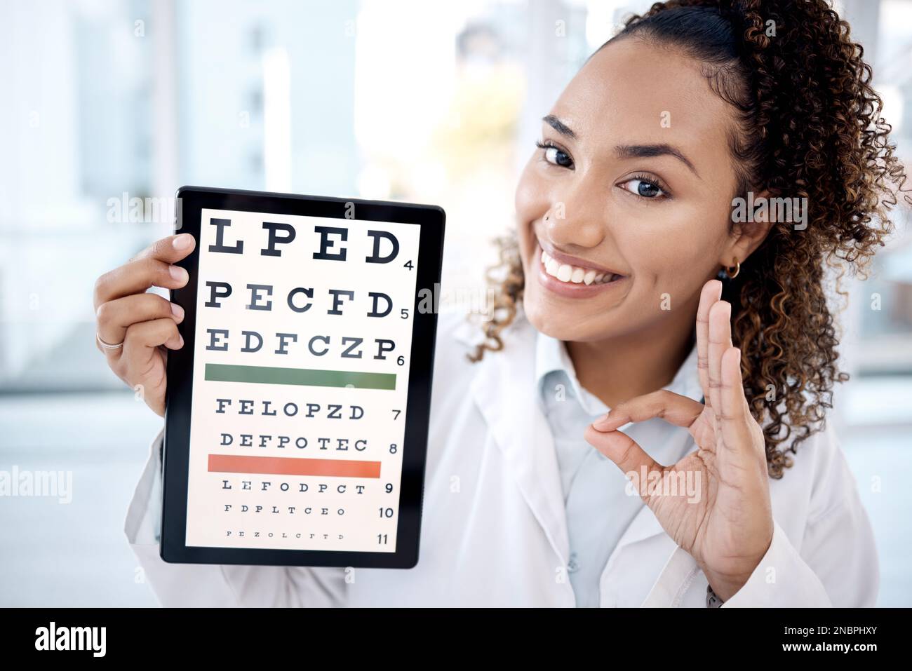 Optometry chart, tablet and doctor with ok sign in hospital for vision ...