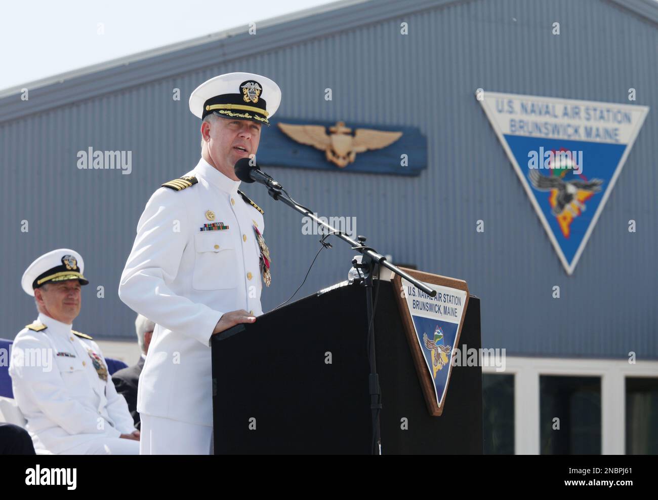 Capt. William Fitzgerald, base commander, speaks at a ceremony marking ...