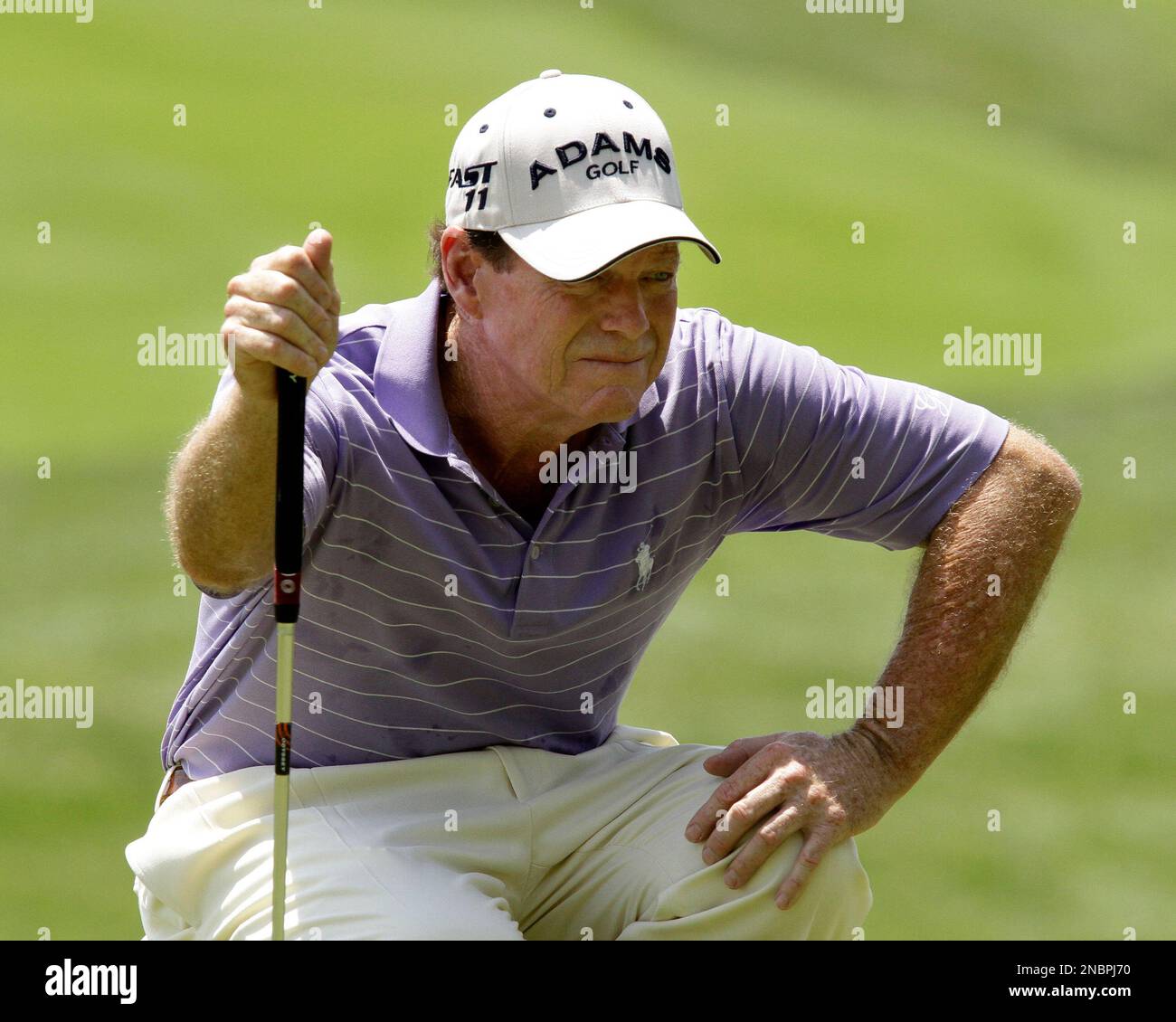 Tom Watson lines up a putt on the No. 8 green in the final round of the ...