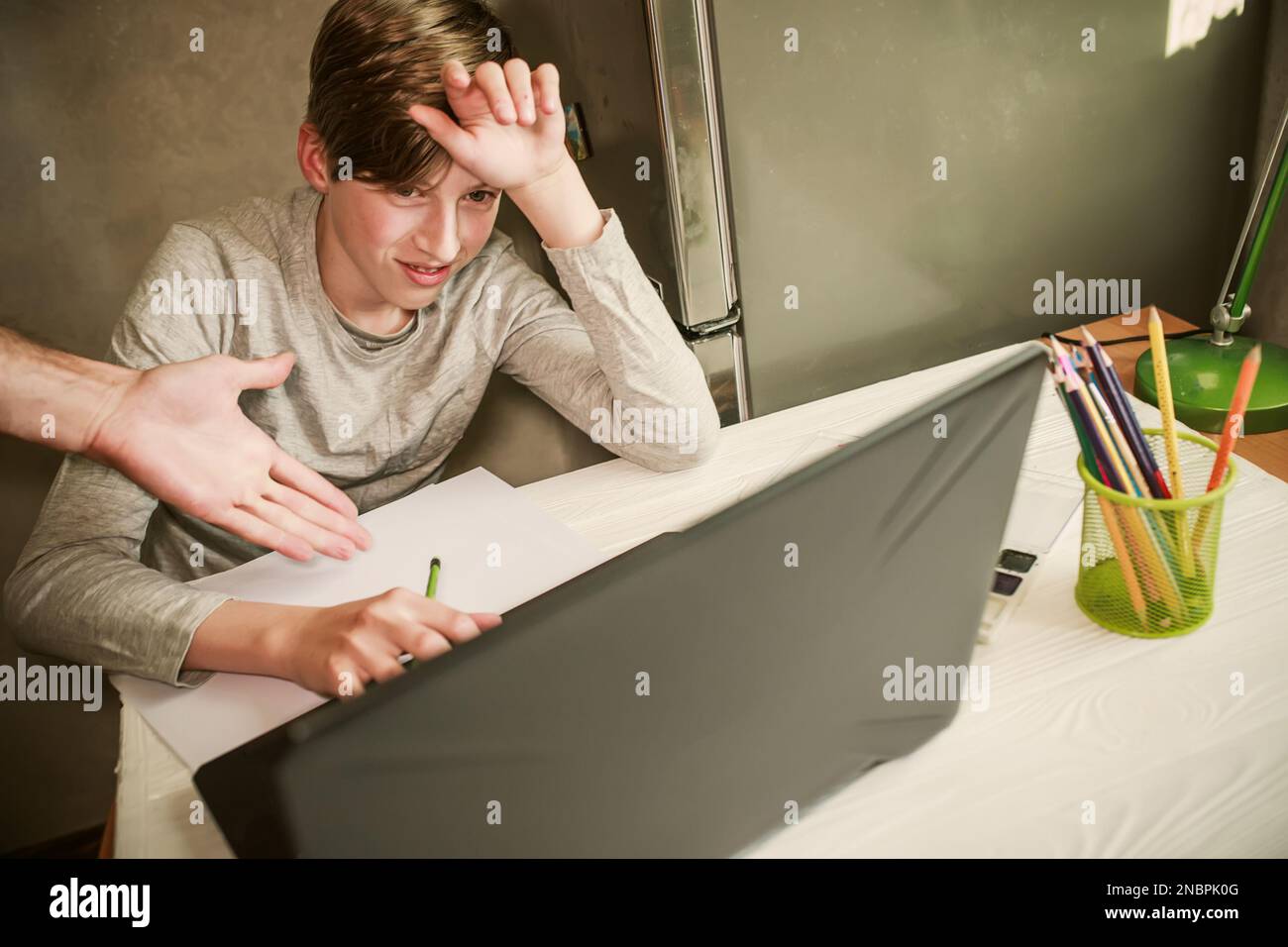 The father's hand indicates errors in learning. The boy does ...